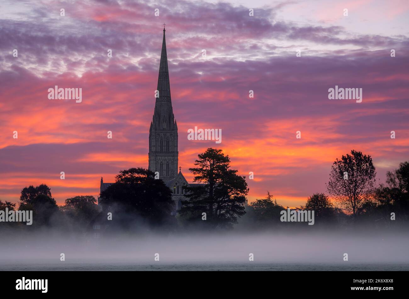 October misty morning sunrise behind Salisbury Cathedral from the ...