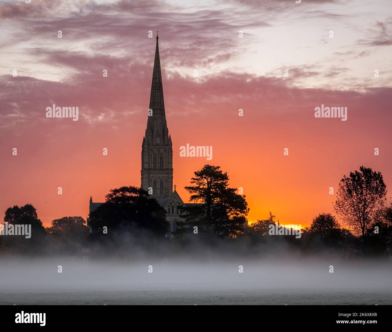 October misty morning sunrise behind Salisbury Cathedral from the ...