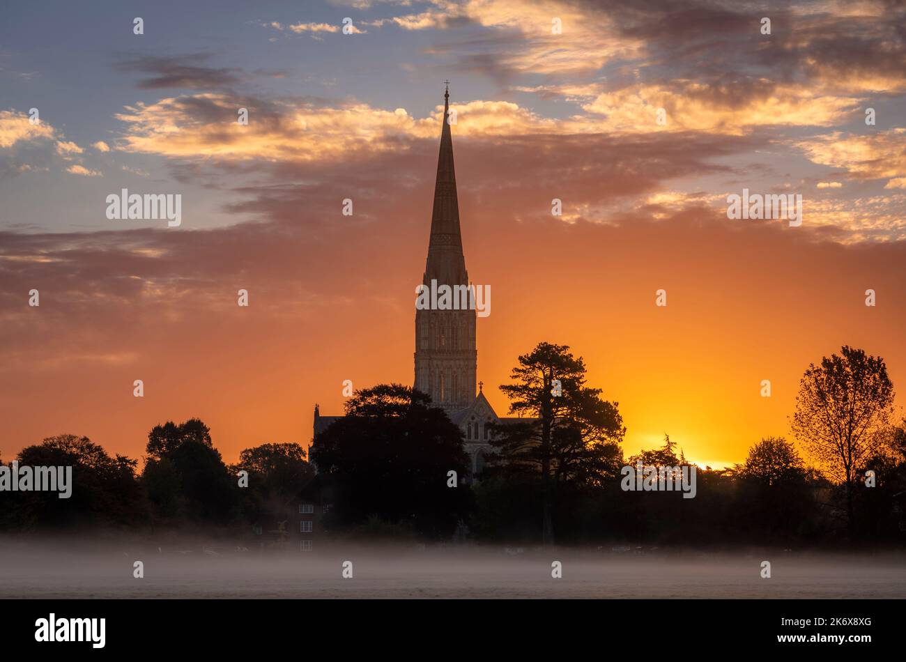 October misty morning sunrise behind Salisbury Cathedral from the ...