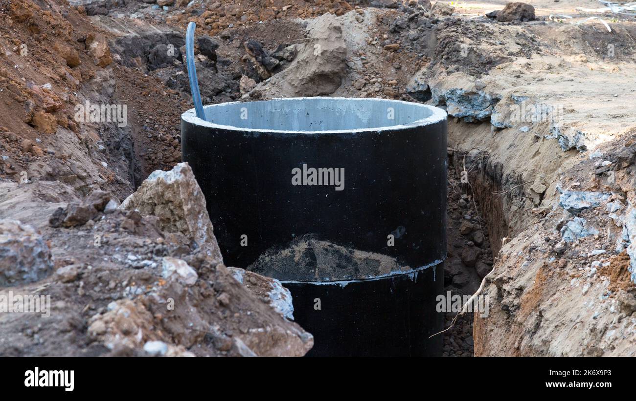 Reinforced concrete building rings set deep into ground Stock Photo - Alamy