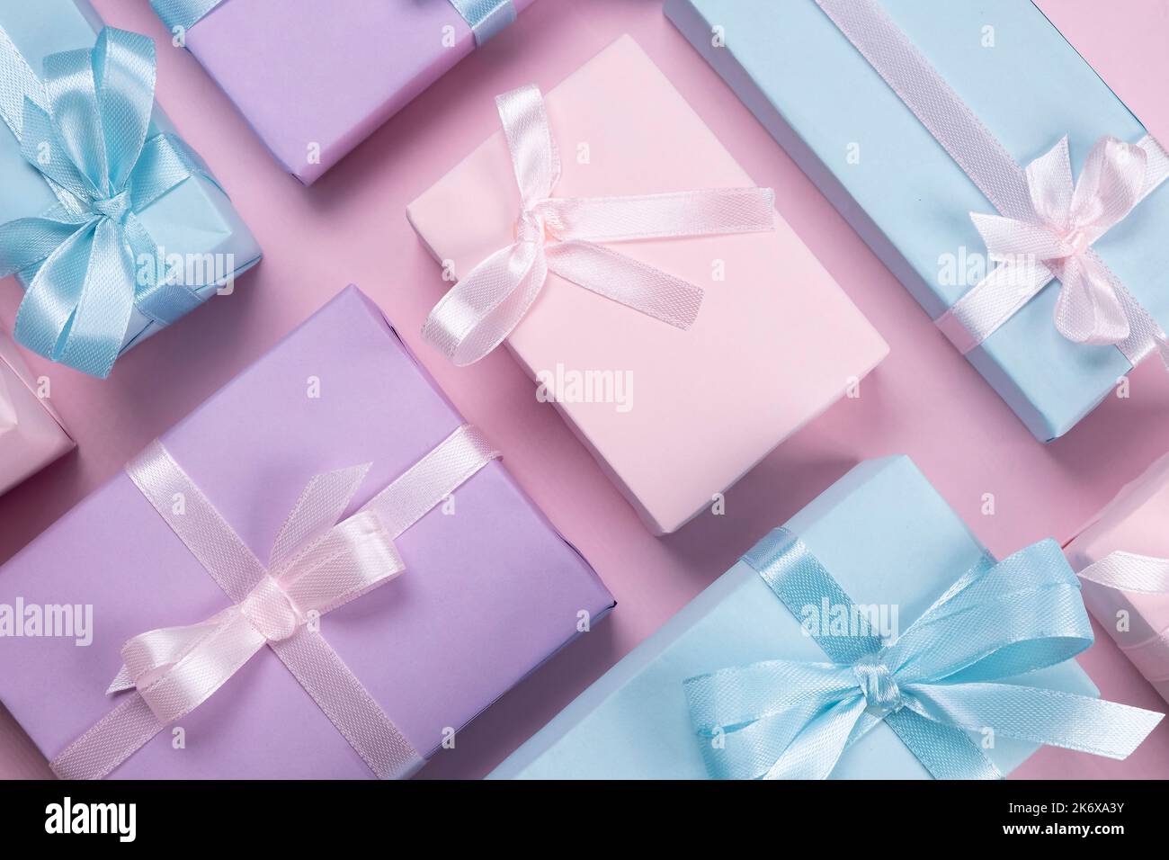 background with colorful gift boxes with ribbons and bows in pastel ...