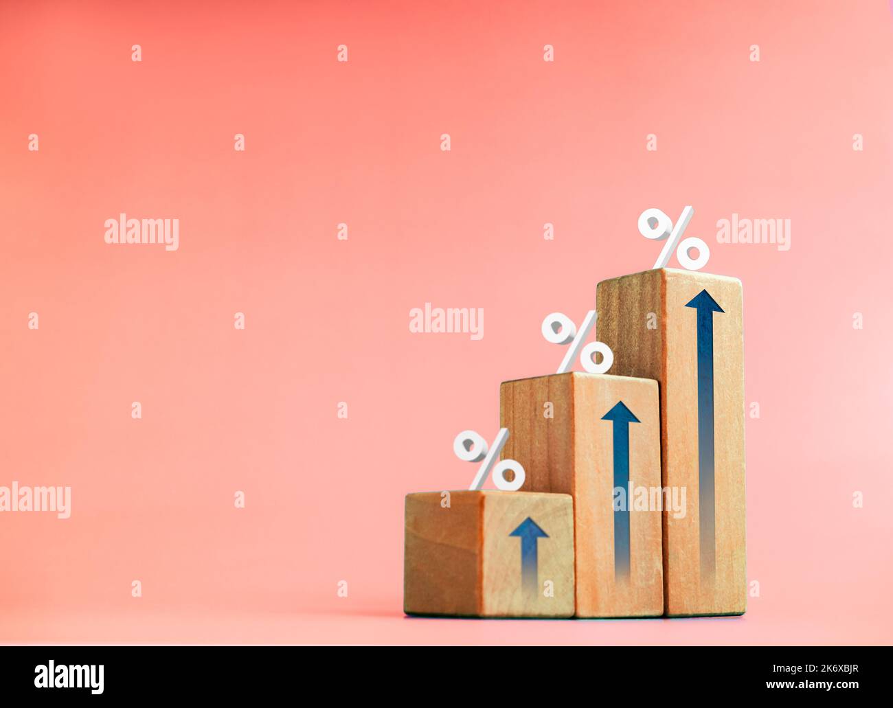 Rise up arrow on wooden cube blocks, bar graph chart steps with ...