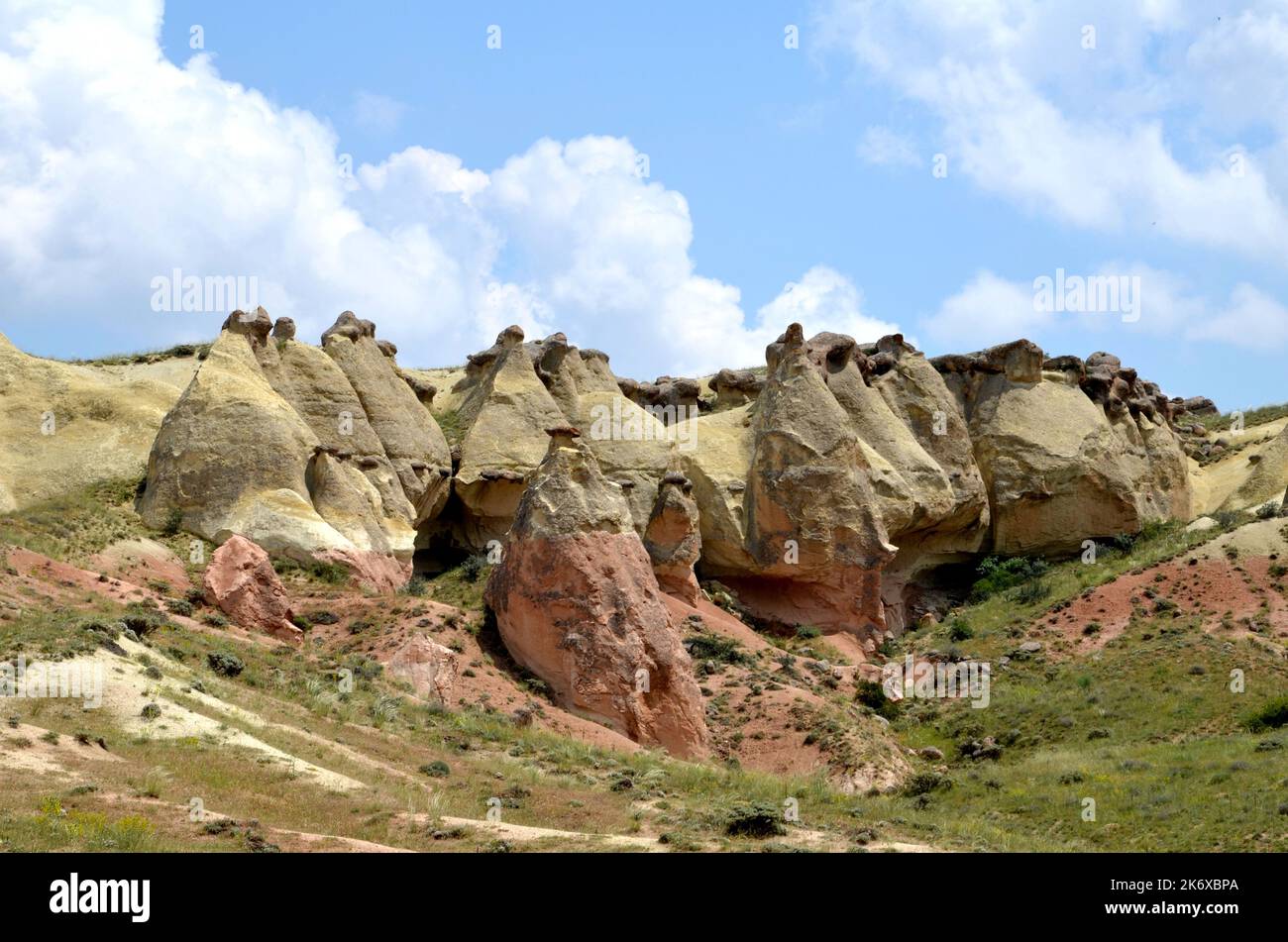 colorful rock formation with plants and meadows in Cappadocia, turkey ...