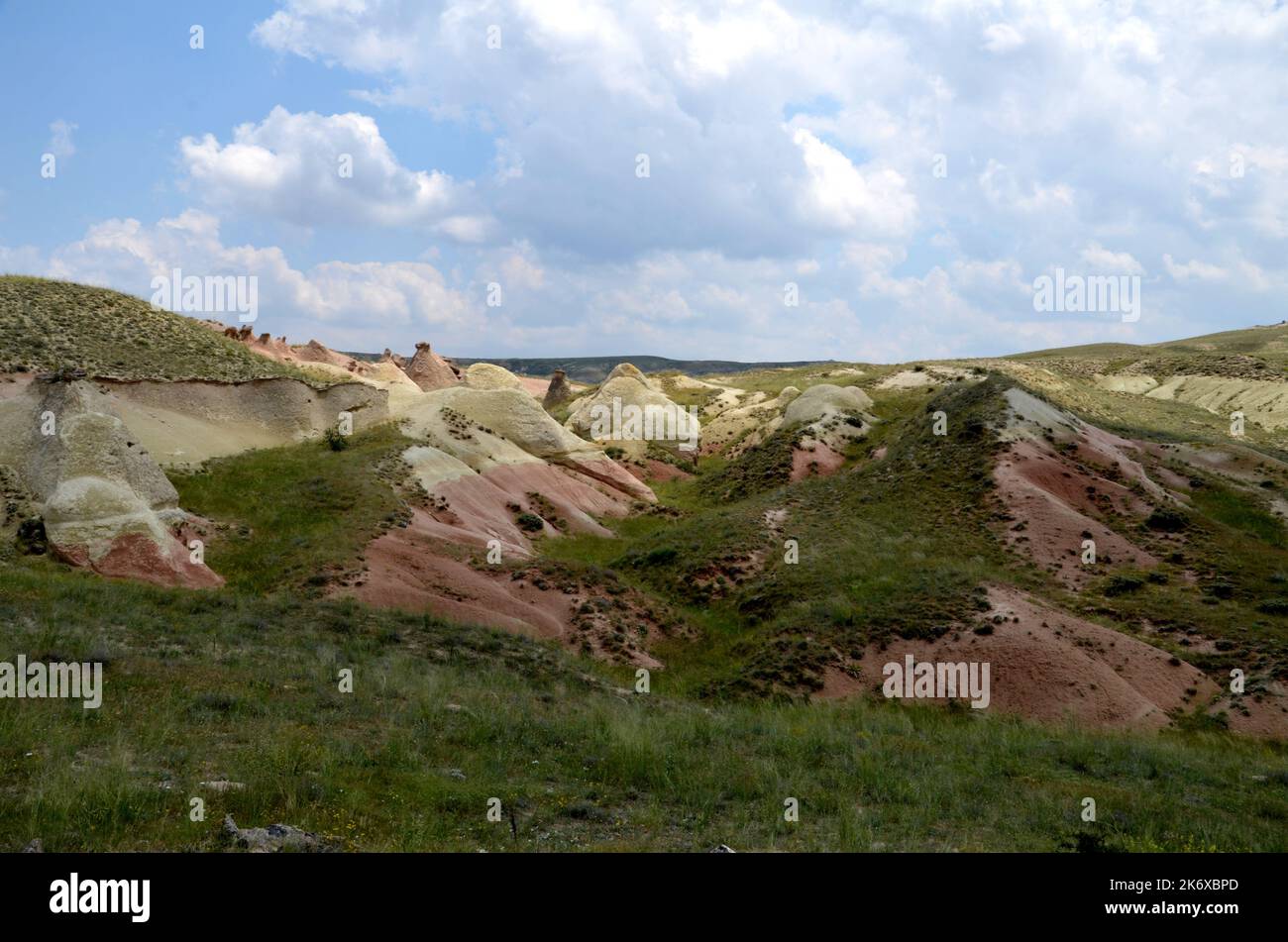 colorful rock formation with plants and meadows in Cappadocia, turkey ...