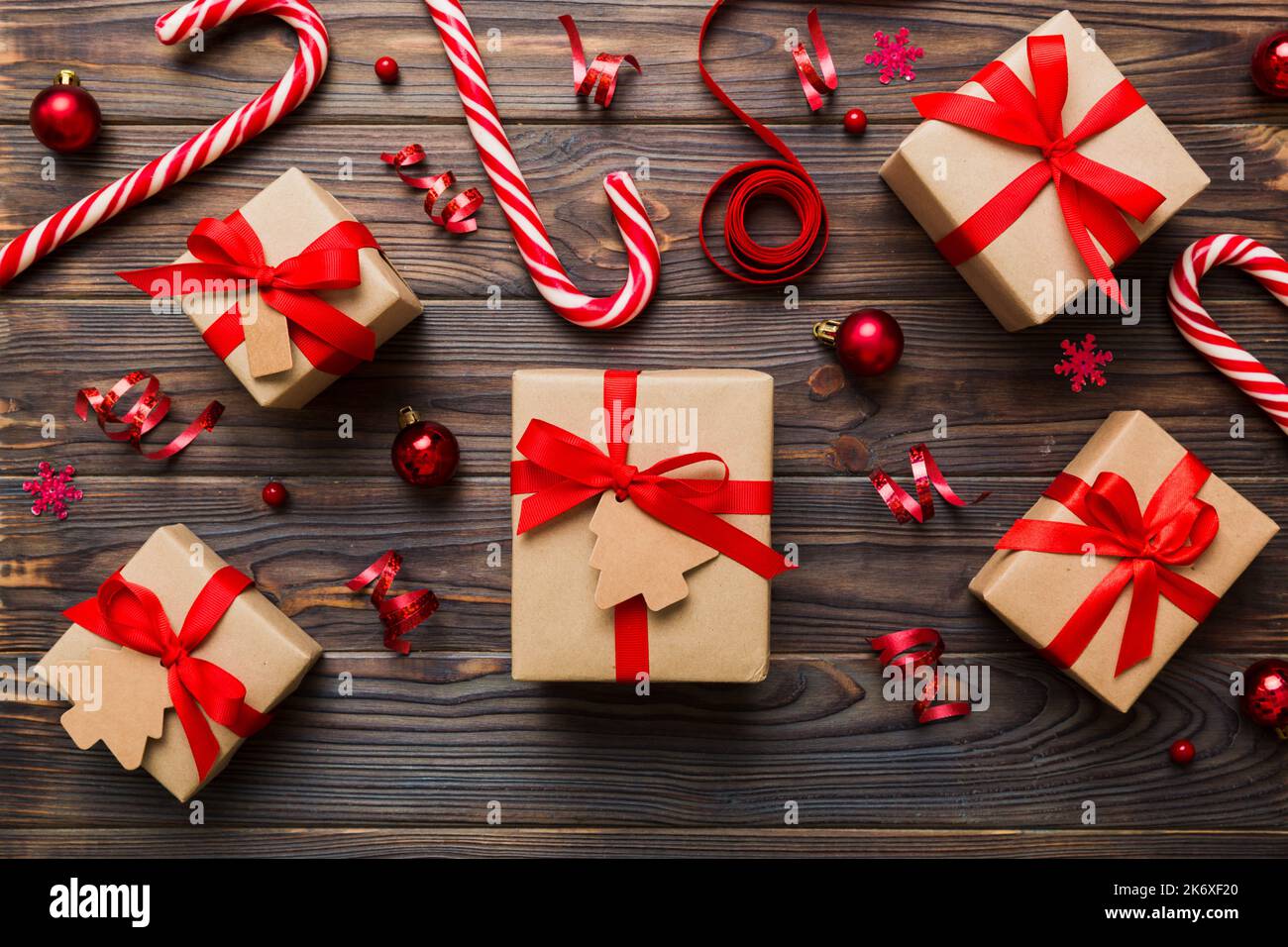 Christmas kraft gifts box with ribbon on colored background. Cozy ...