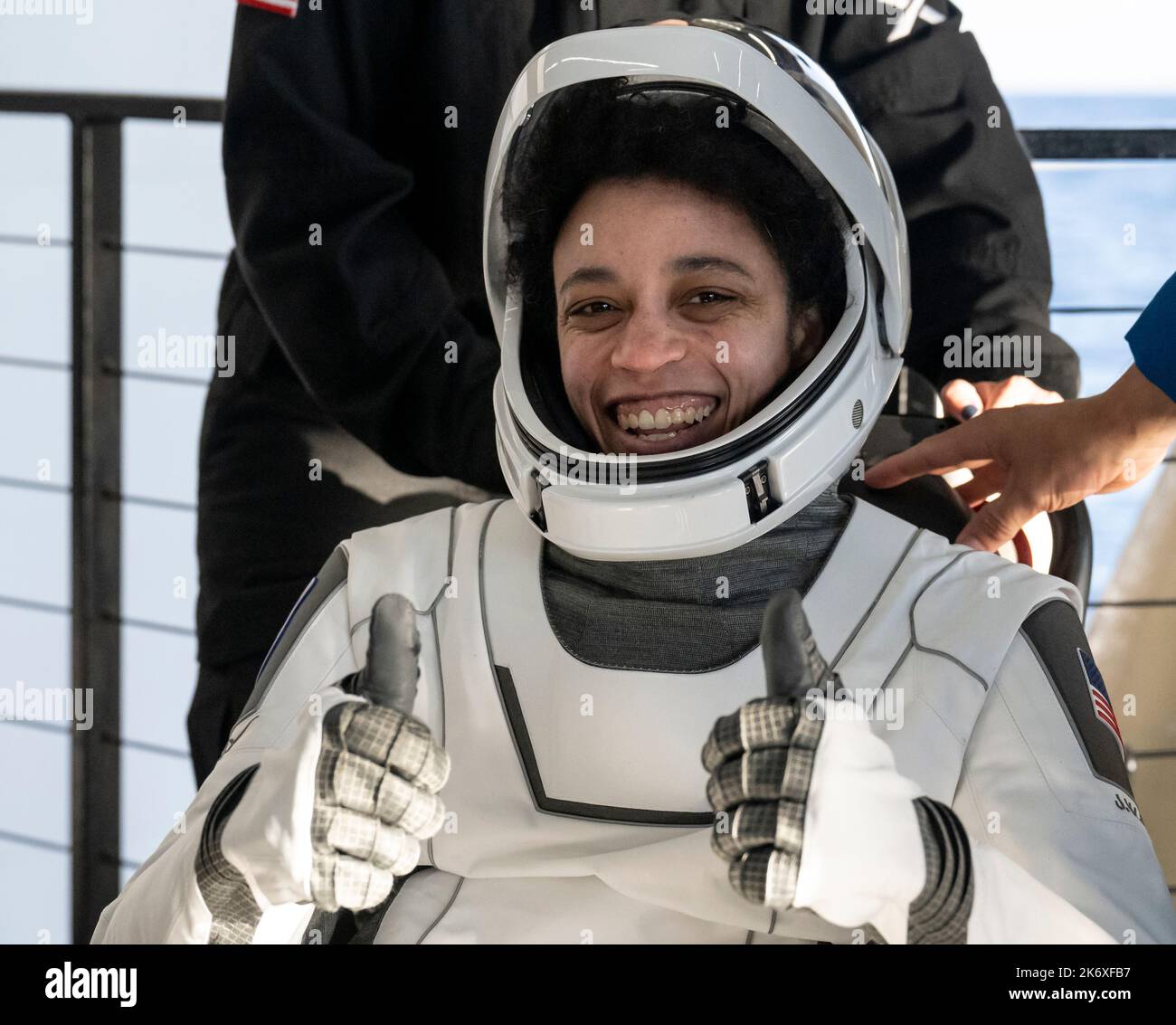 NASA astronaut Jessica Watkins is helped out of the SpaceX Crew Dragon Freedom spacecraft ...
