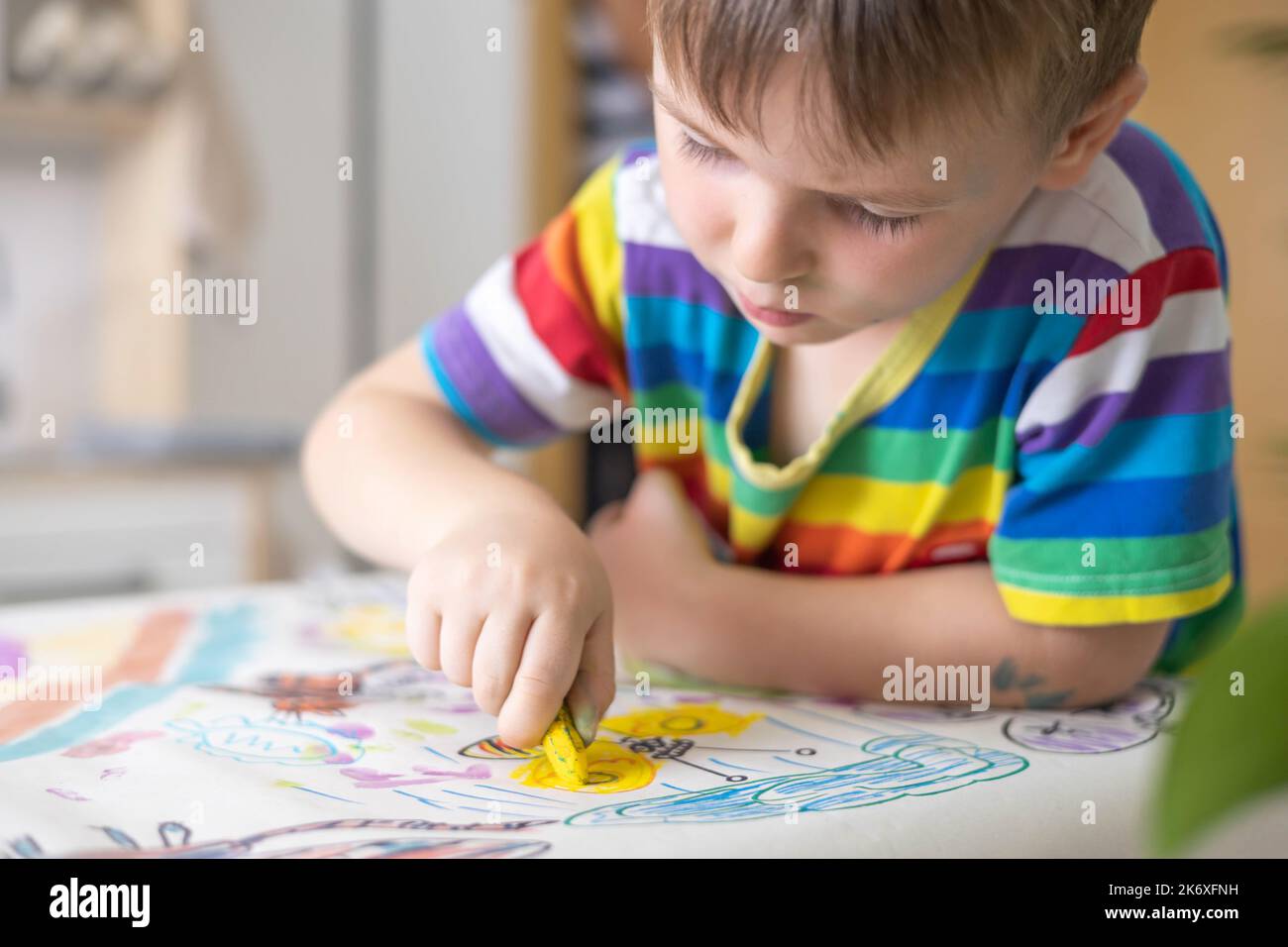 Confident cute male kid art drawing multicolored rainbow arch use ...