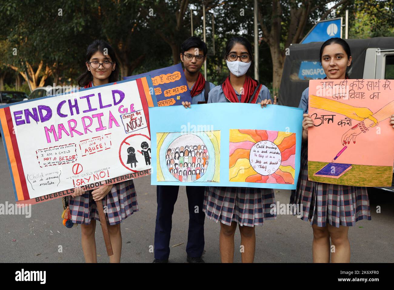 Students from different schools hold placards during ‘Child marriage ...