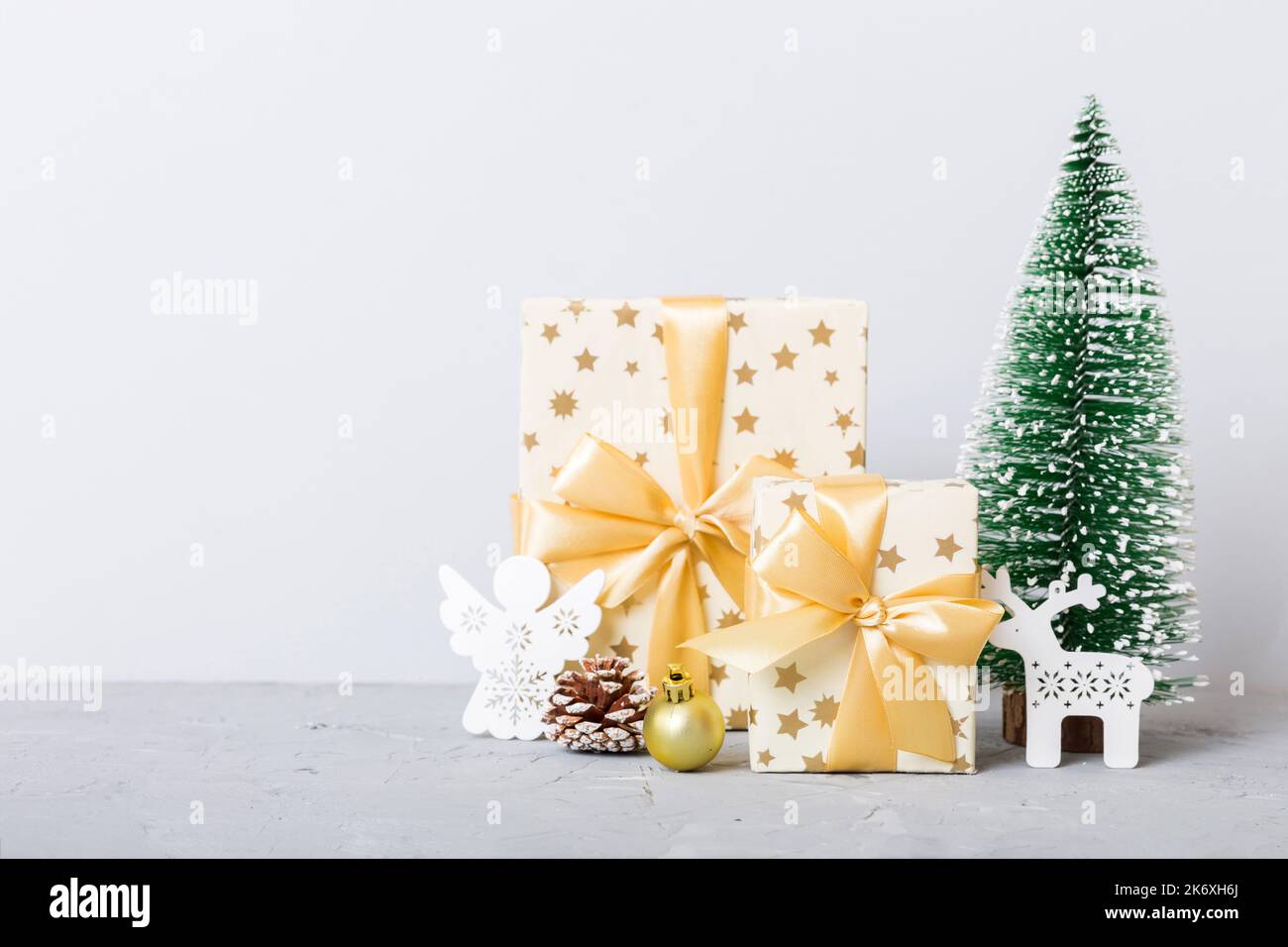 Christmas composition. craft Gift box, small tree, branches and craft ...