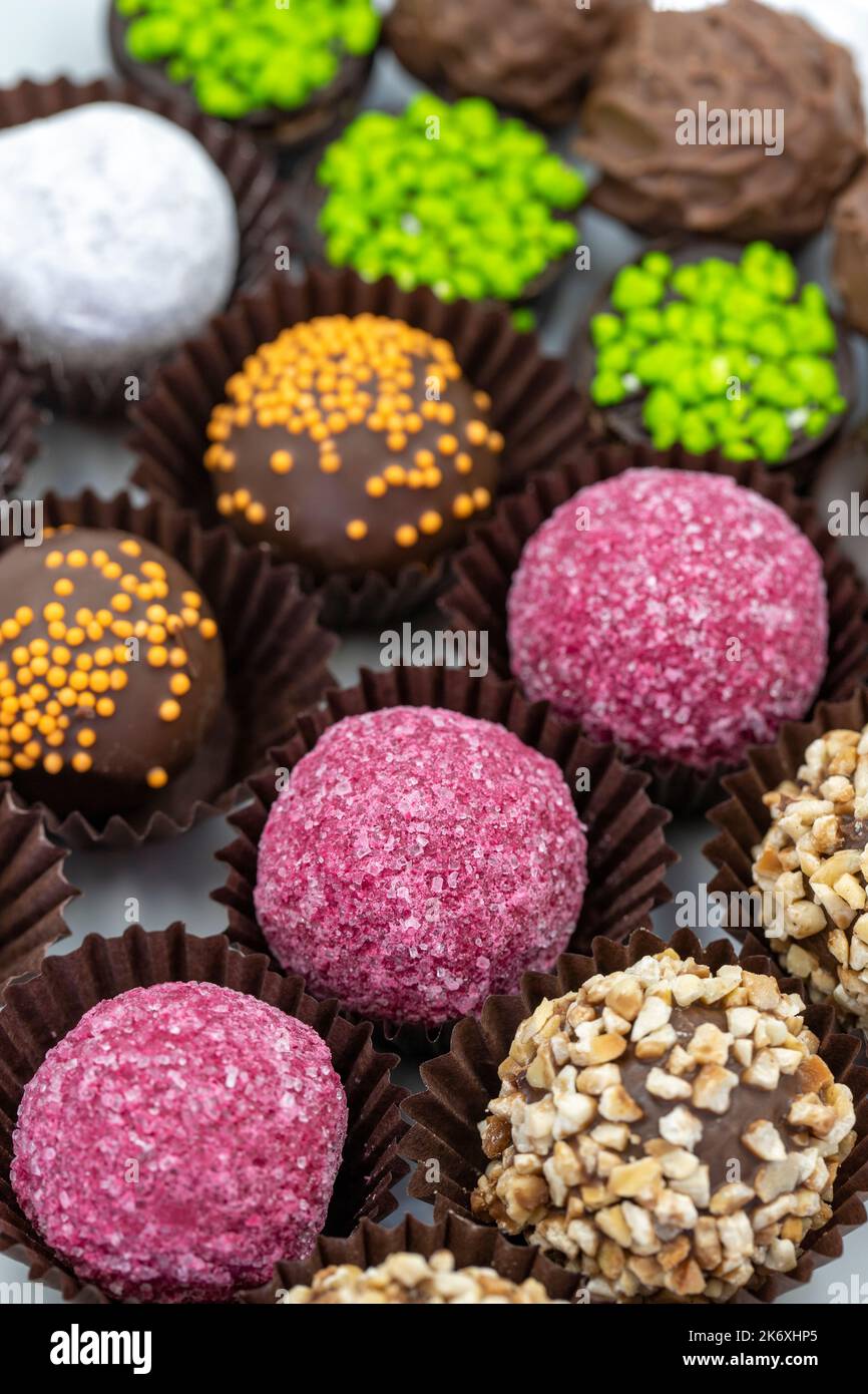 Chocolate praline. Assortment of chocolates on a white background. Top ...