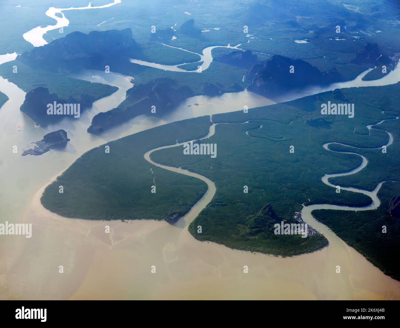 Aerial view flying over green large mangrove forests near the Andaman ...