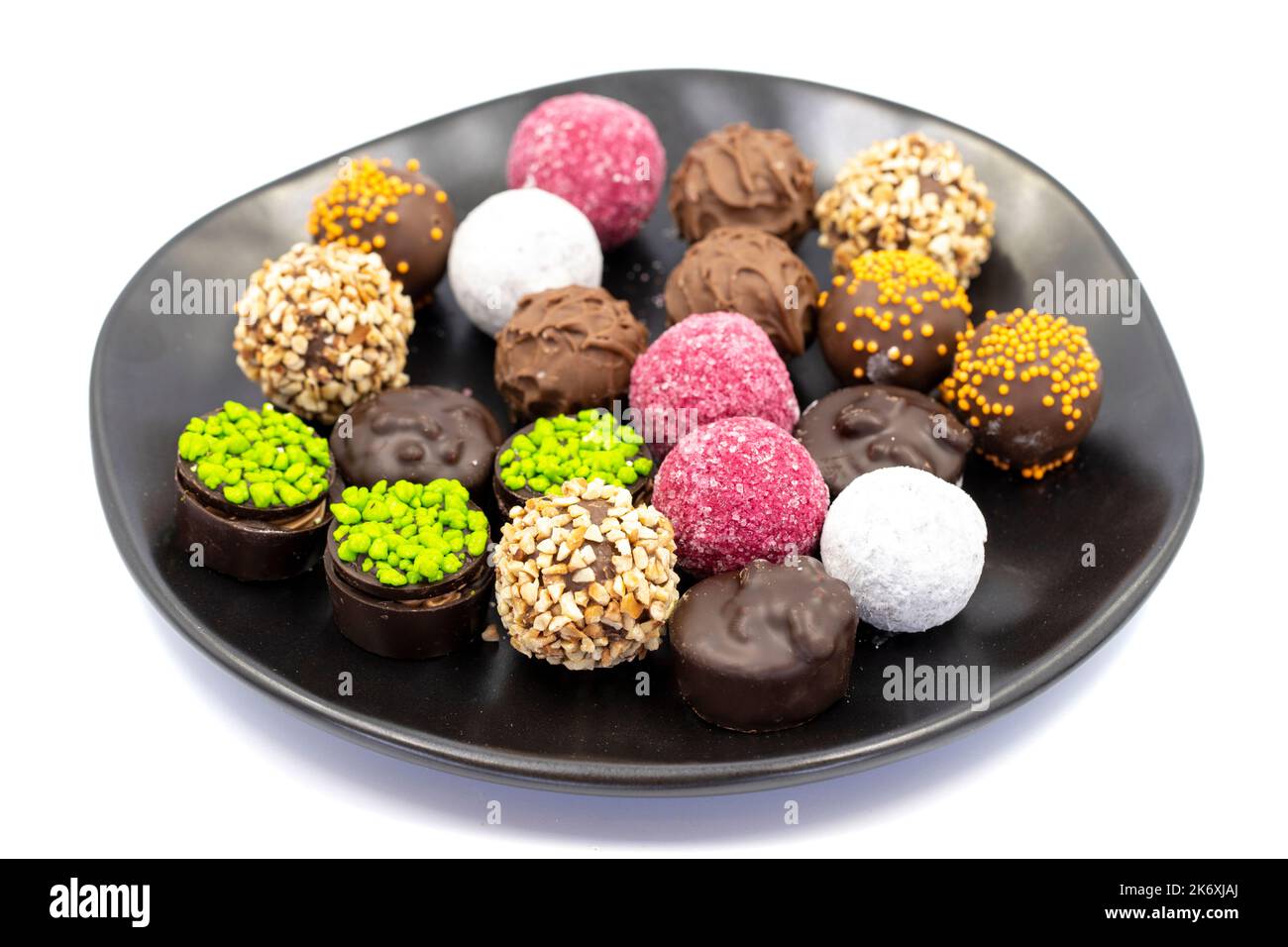 Chocolate praline. Assortment of chocolates on a white background ...