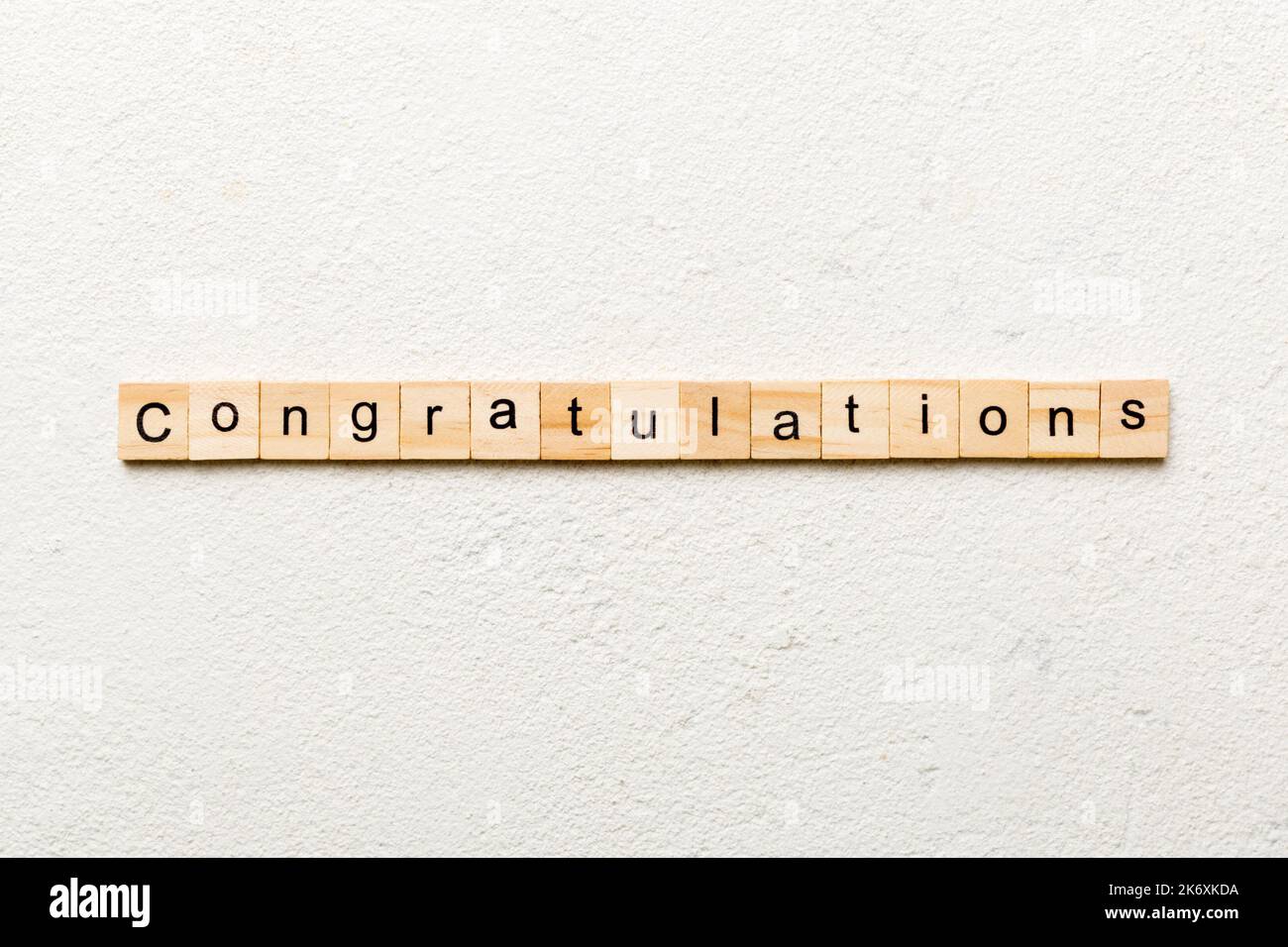 congratulations word written on wood block. congratulations text on ...