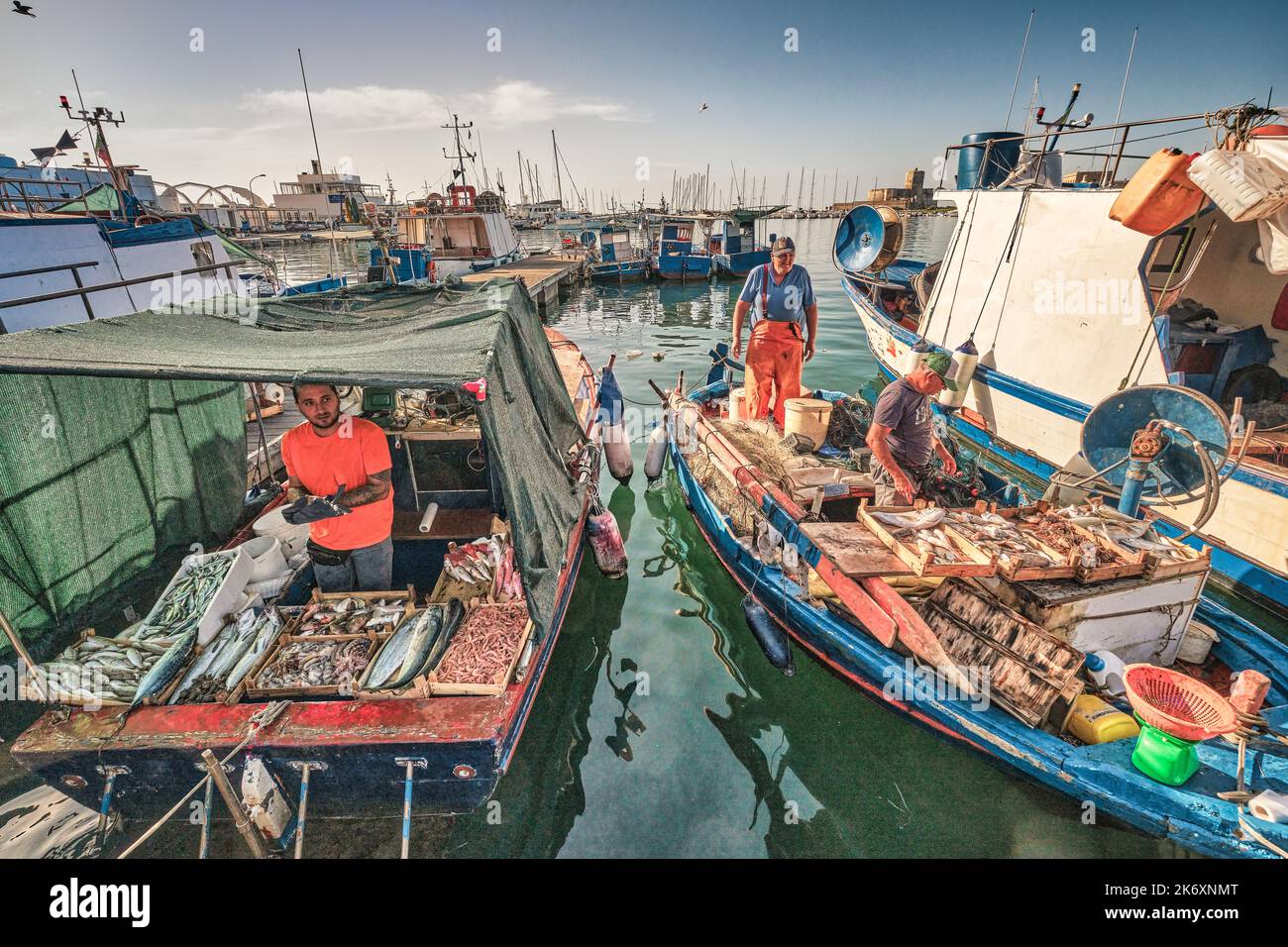 Group fishermen fishing in port hi-res stock photography and images - Alamy