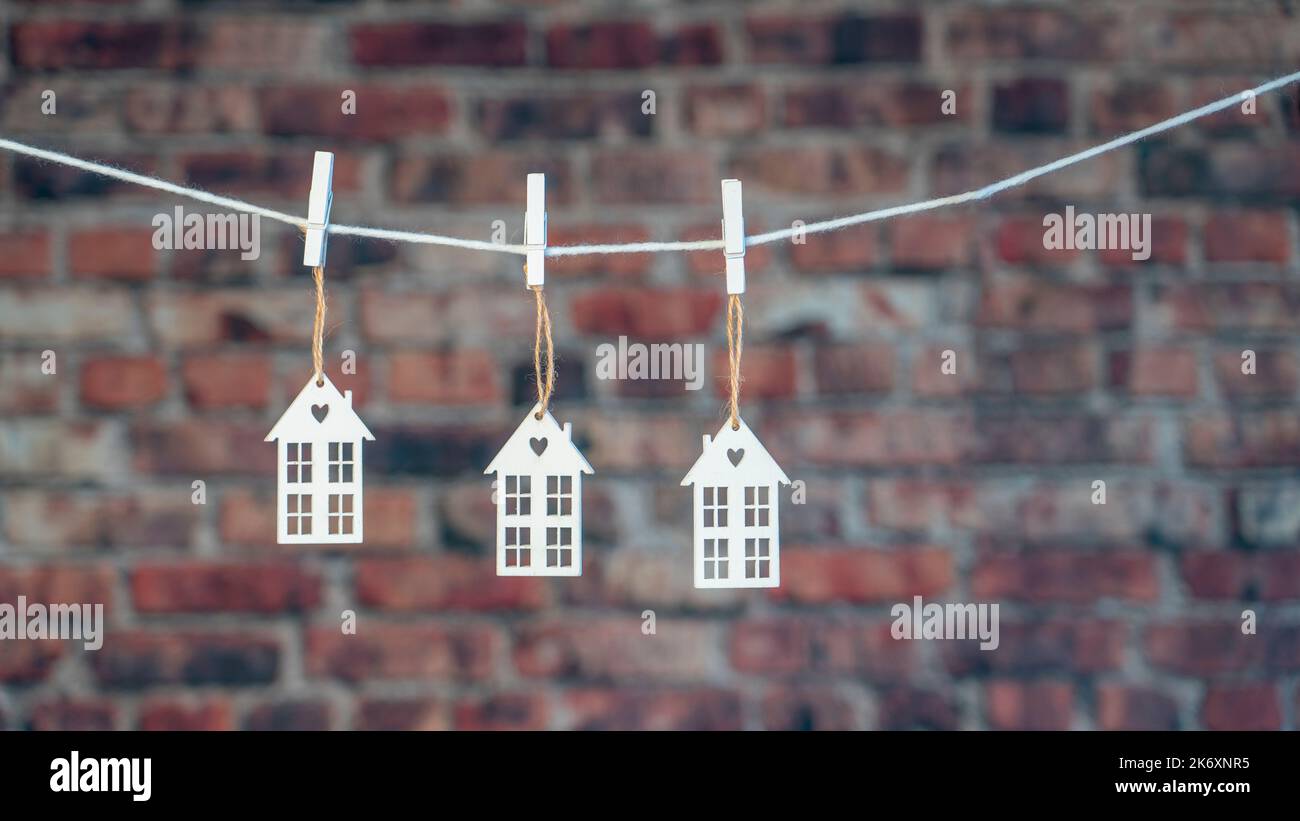 Houses, Clothesline and clip on brick wall background. Flat lay, top ...