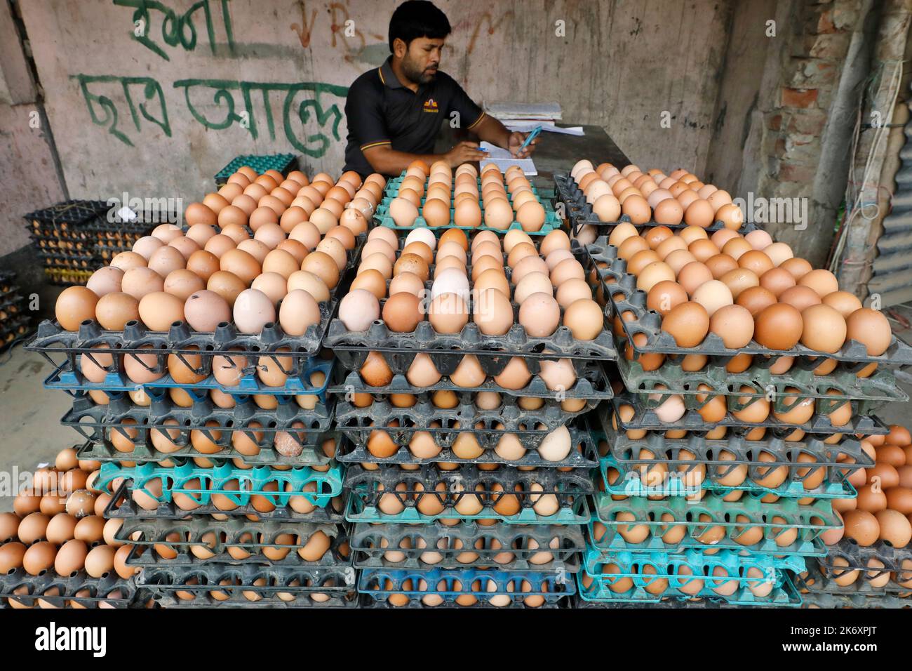 Dhaka, Bangladesh - September 08, 2022: Bangladeshi traders wait for customers by arranging eggs ...