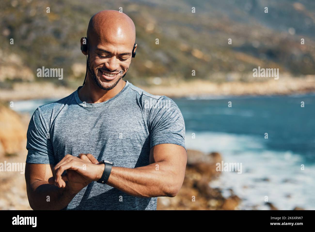 The last reps is what makes the muscle grow. a man using his watch to ...