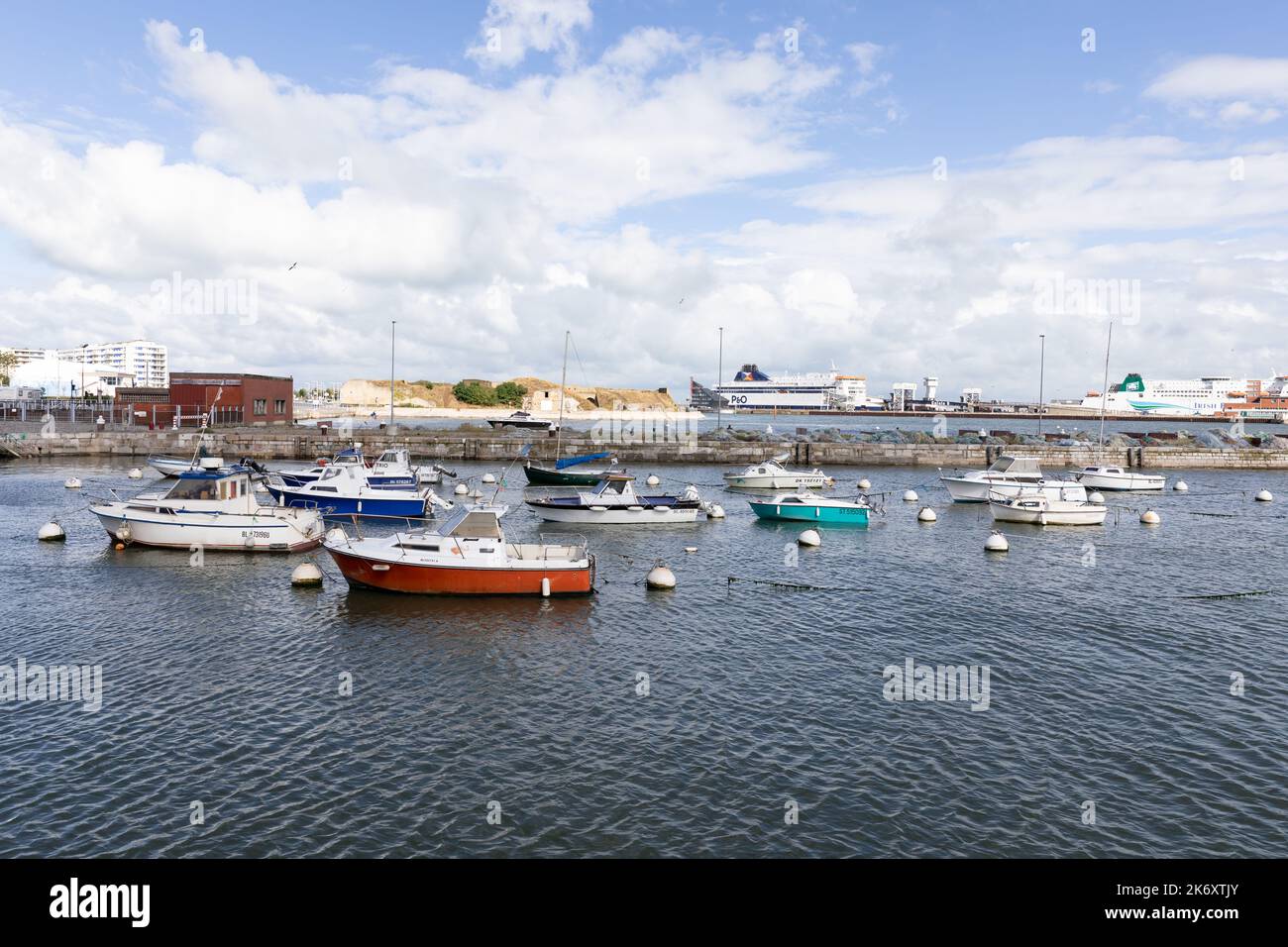 Colourful boats at a harbour under a vivid blue sky in a city. P&O ...