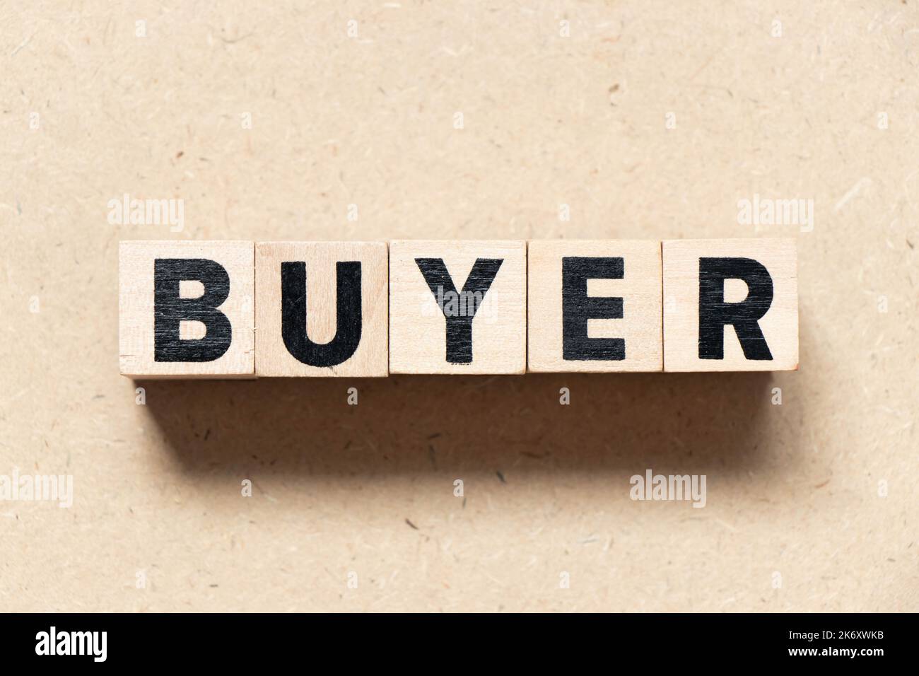 Alphabet letter block in word buyer on wood background Stock Photo - Alamy