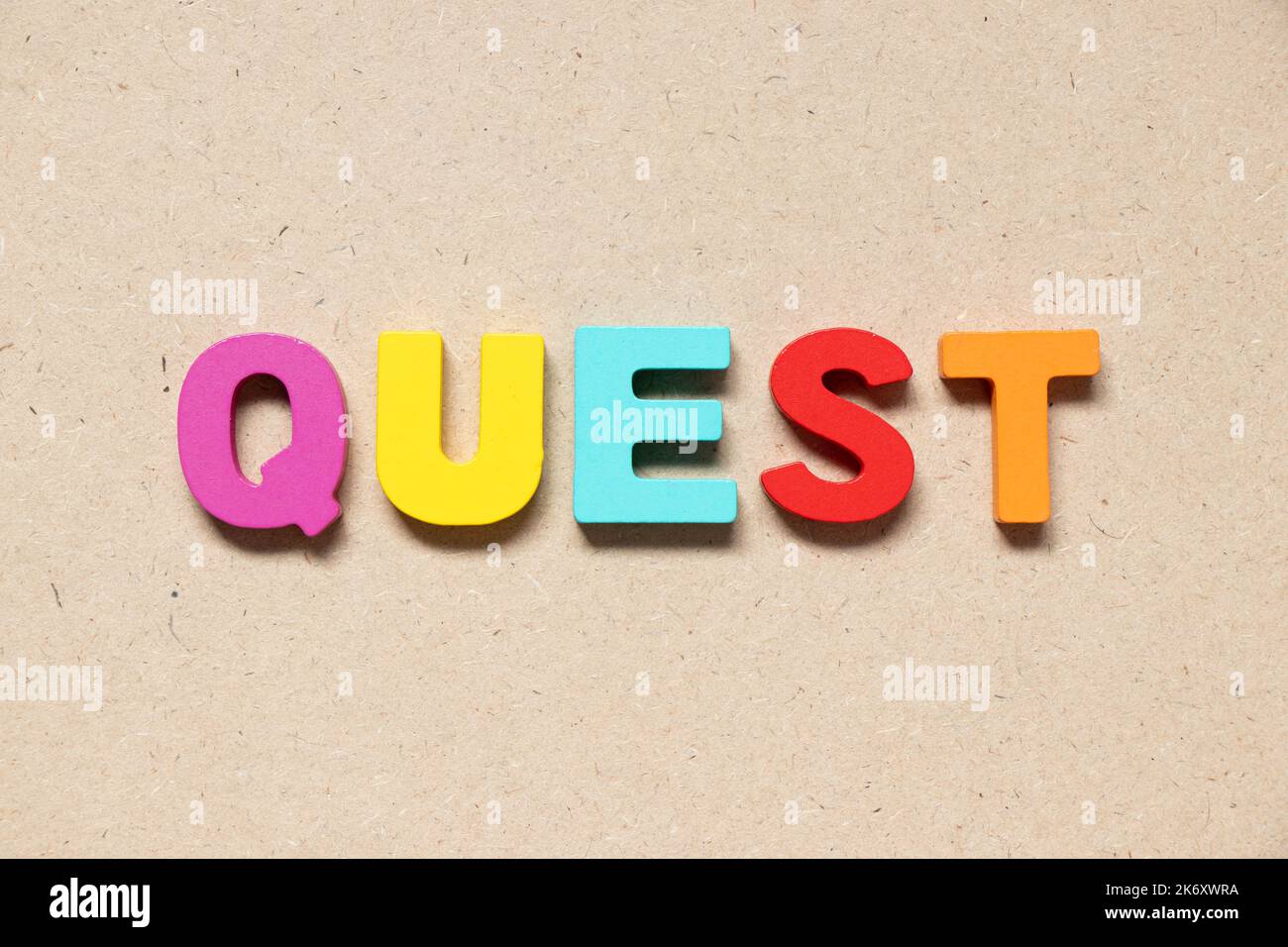 Color alphabet letter in word quest on wood background Stock Photo - Alamy