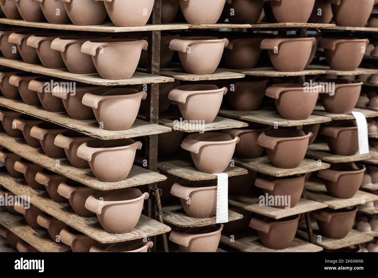 Unfinished clay cups ready for glazing Stock Photo - Alamy