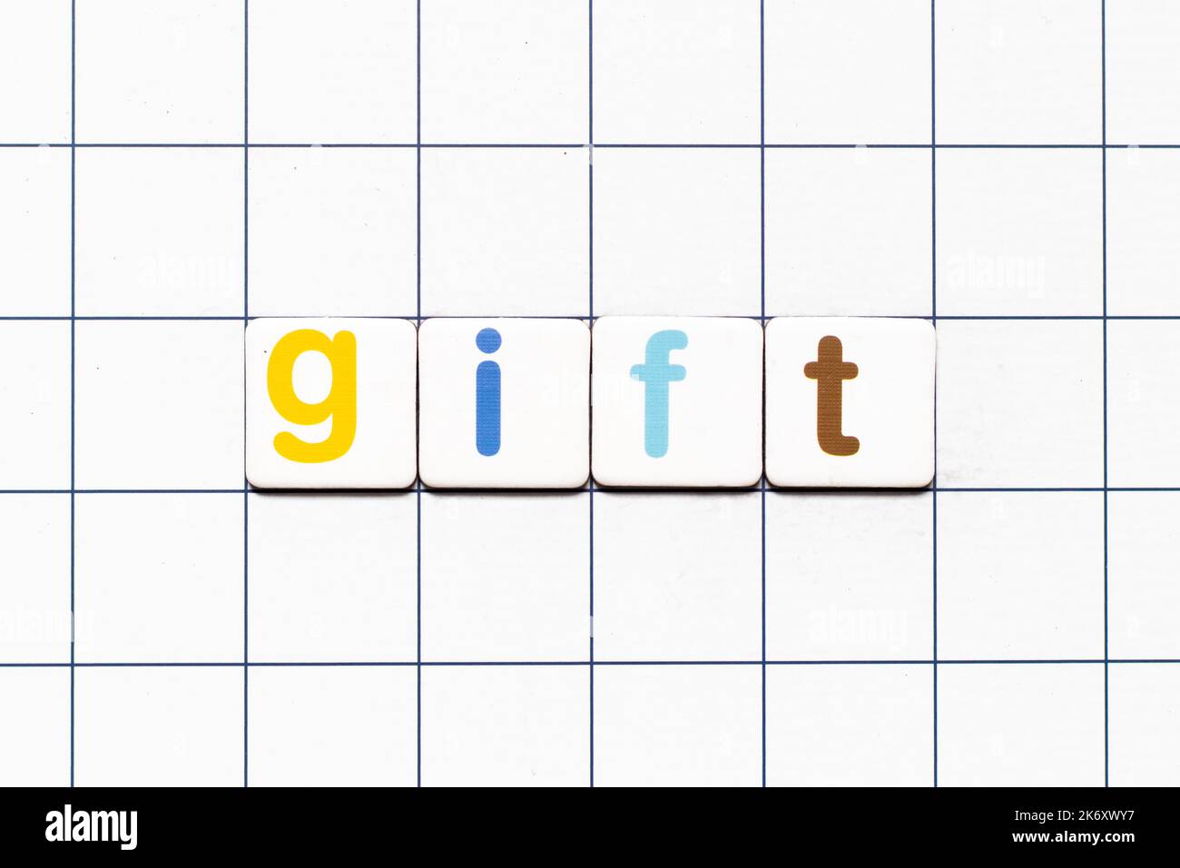 Colorful tile letter in word gift on white grid background Stock Photo ...