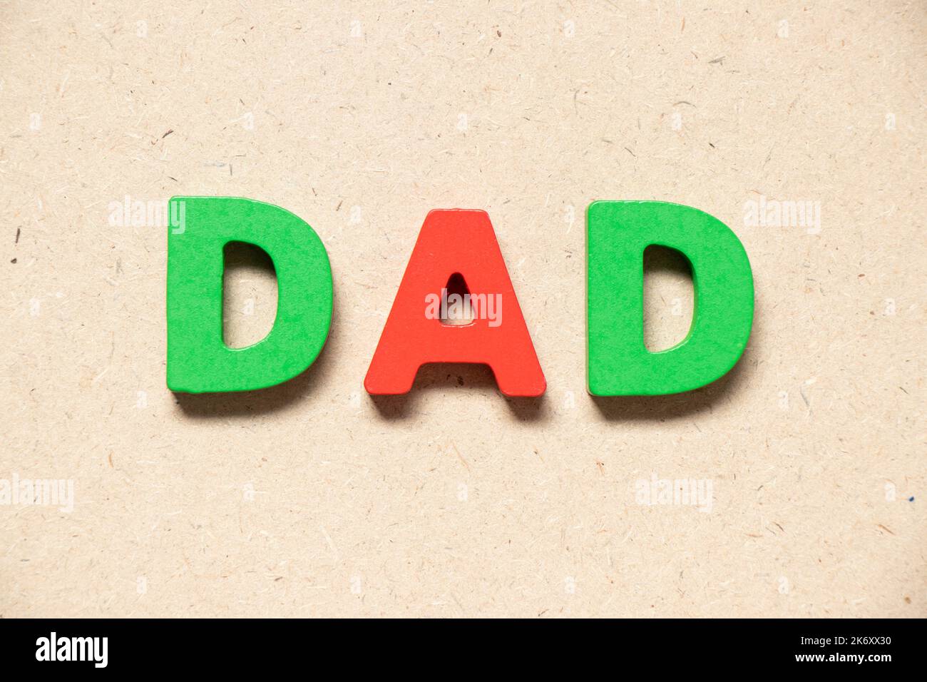 Color alphabet letter in word dad on wood background Stock Photo - Alamy
