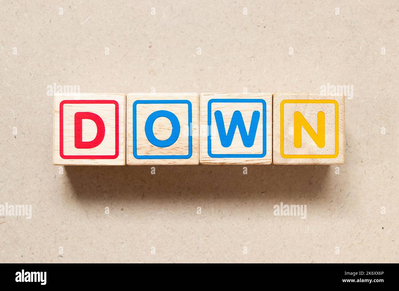 Color letter block in word down on wood background Stock Photo - Alamy