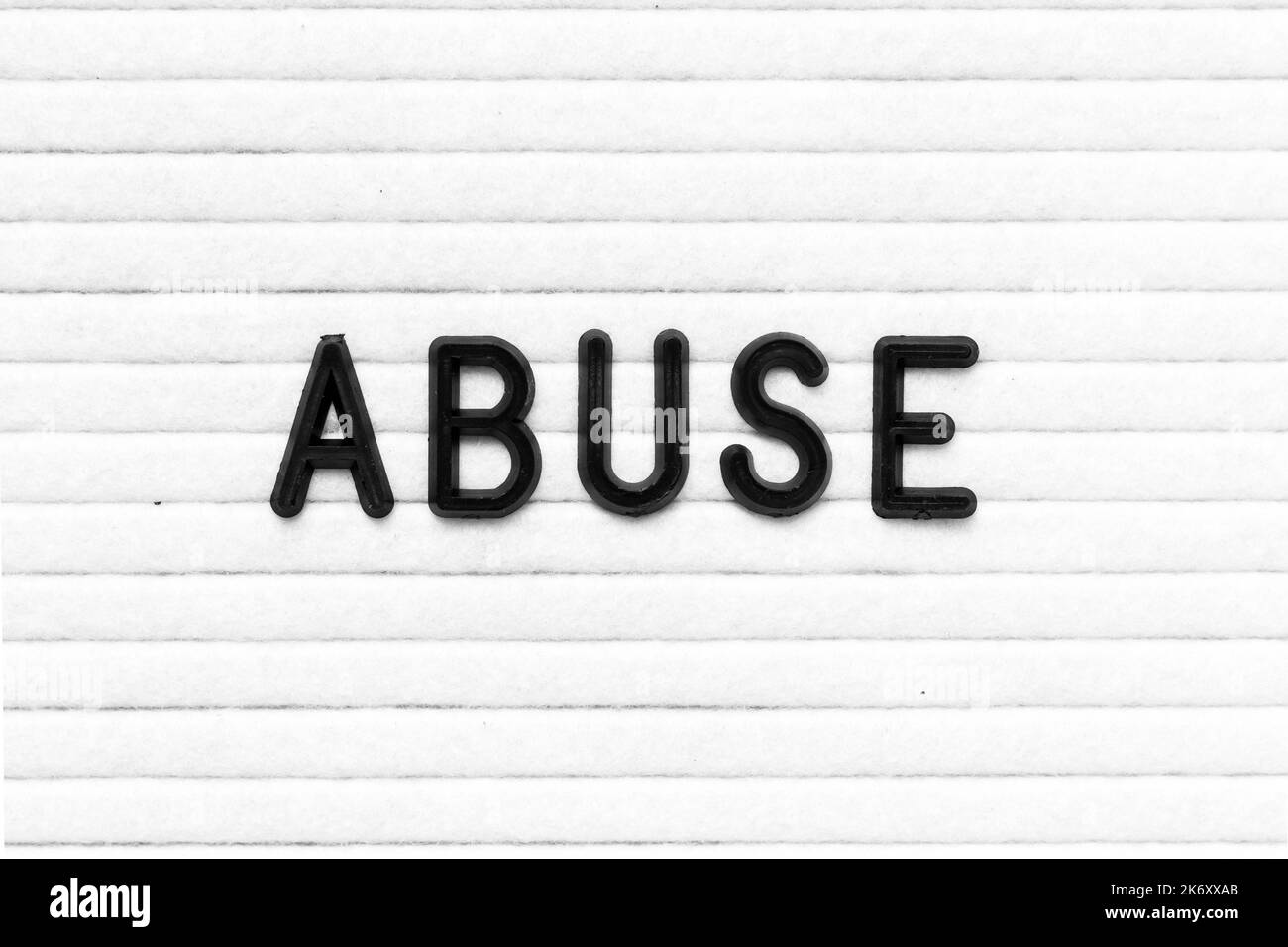 Black color letter in word abuse on white felt board background Stock ...