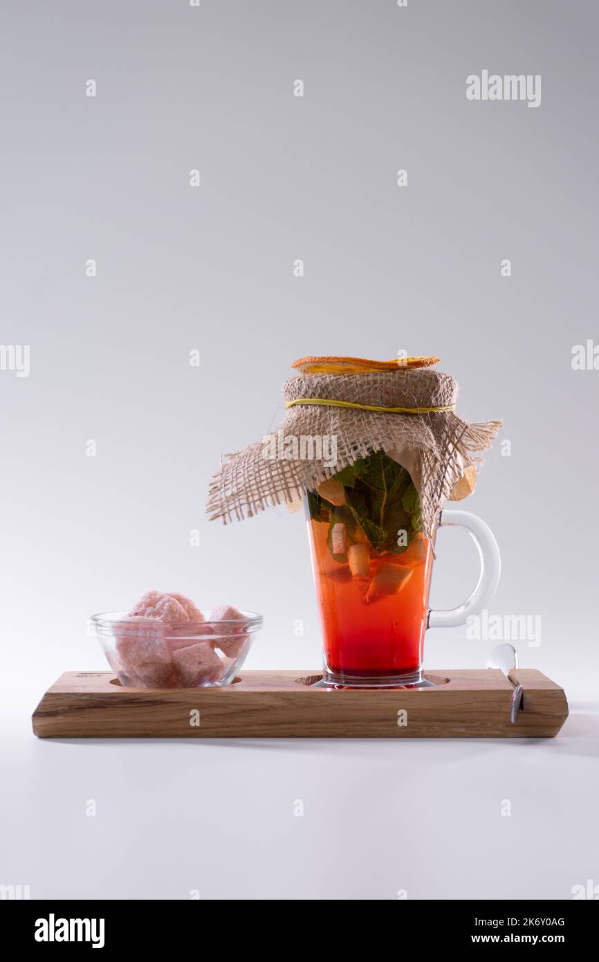 fresh vitamin red ginger tea cup with strawberry, mint, pink sugar ...