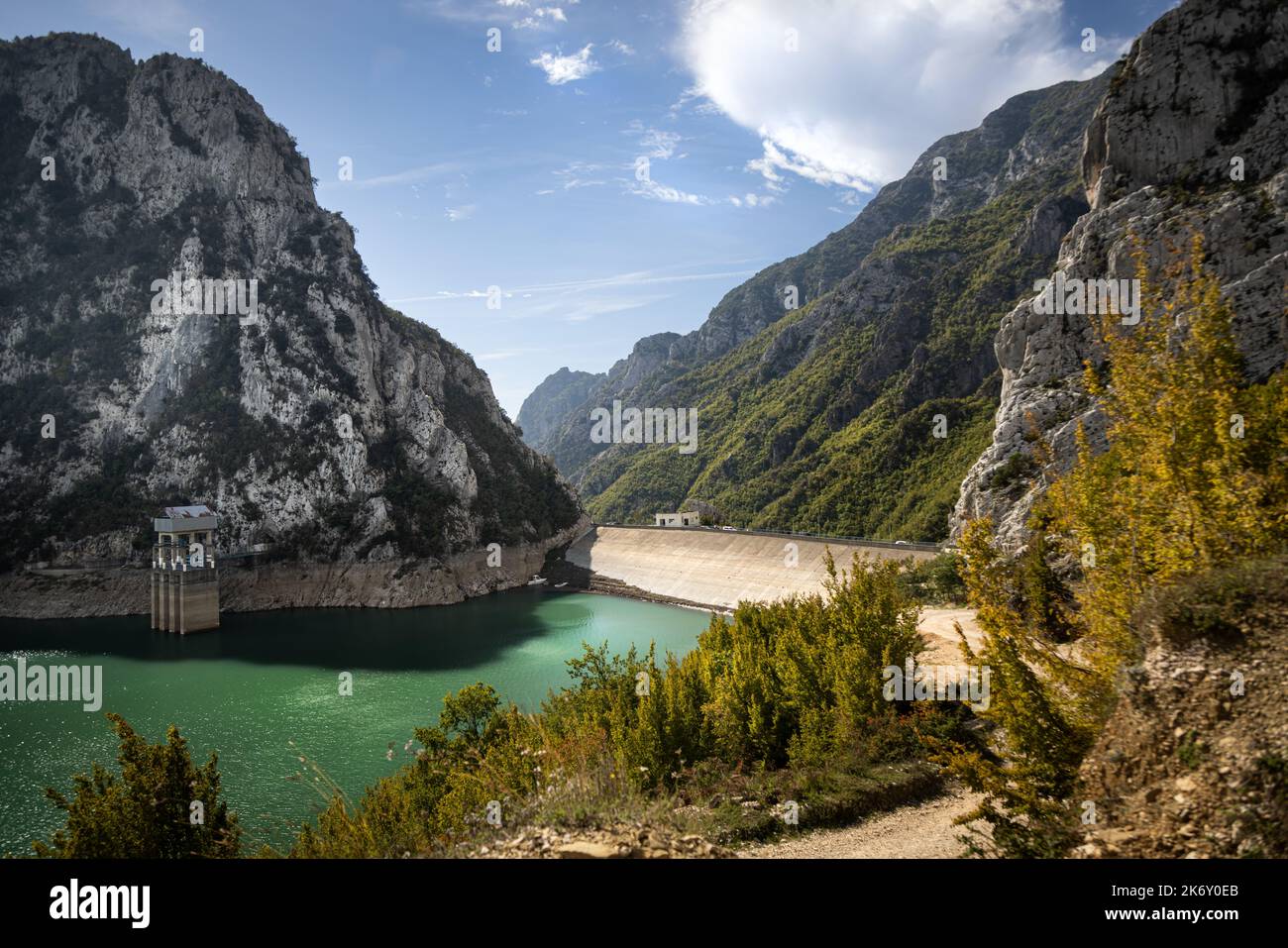 The water reservoir Lake Bovilla and the dam surrounded by mountains ...