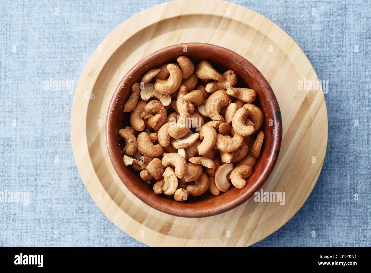 overhead view of cashew nuts in a bowl on table Stock Photo - Alamy
