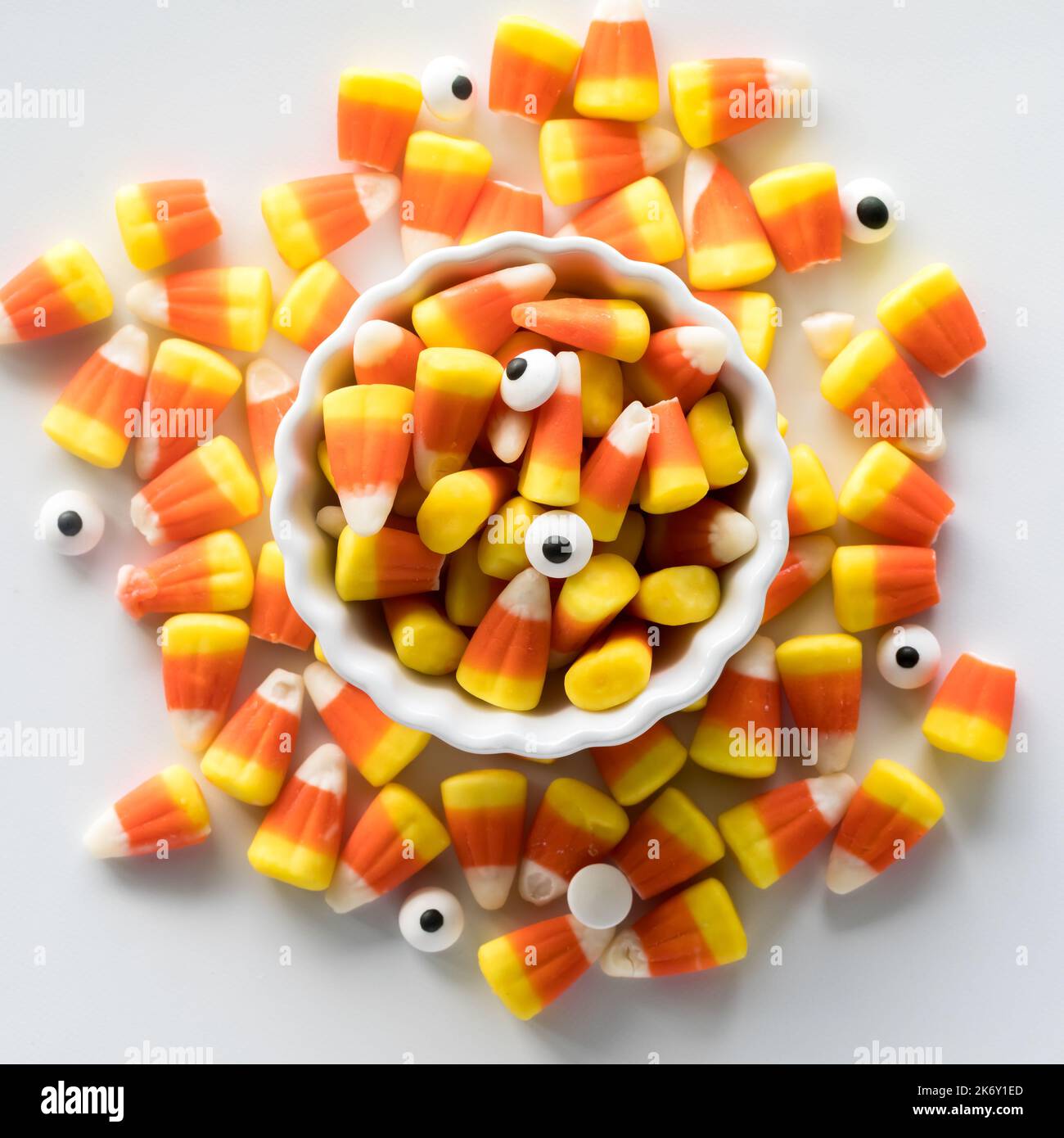 An overflowing bowl of candy corn and candy eyeballs for Halloween ...