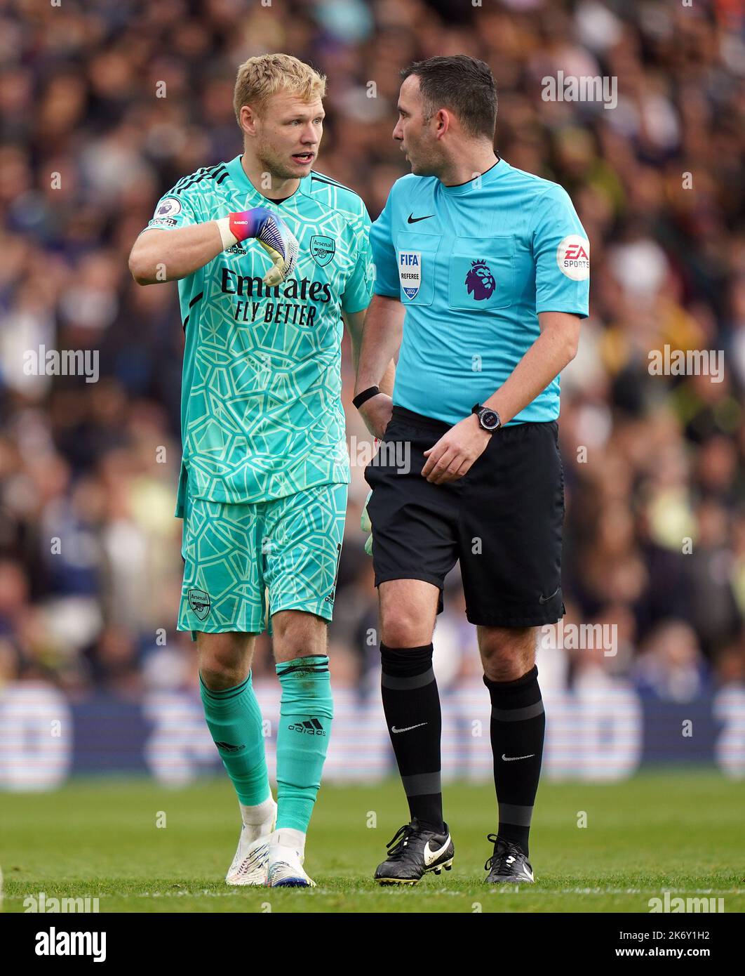 Arsenal goalkeeper Aaron Ramsdale and referee Chris Kavanagh during the ...