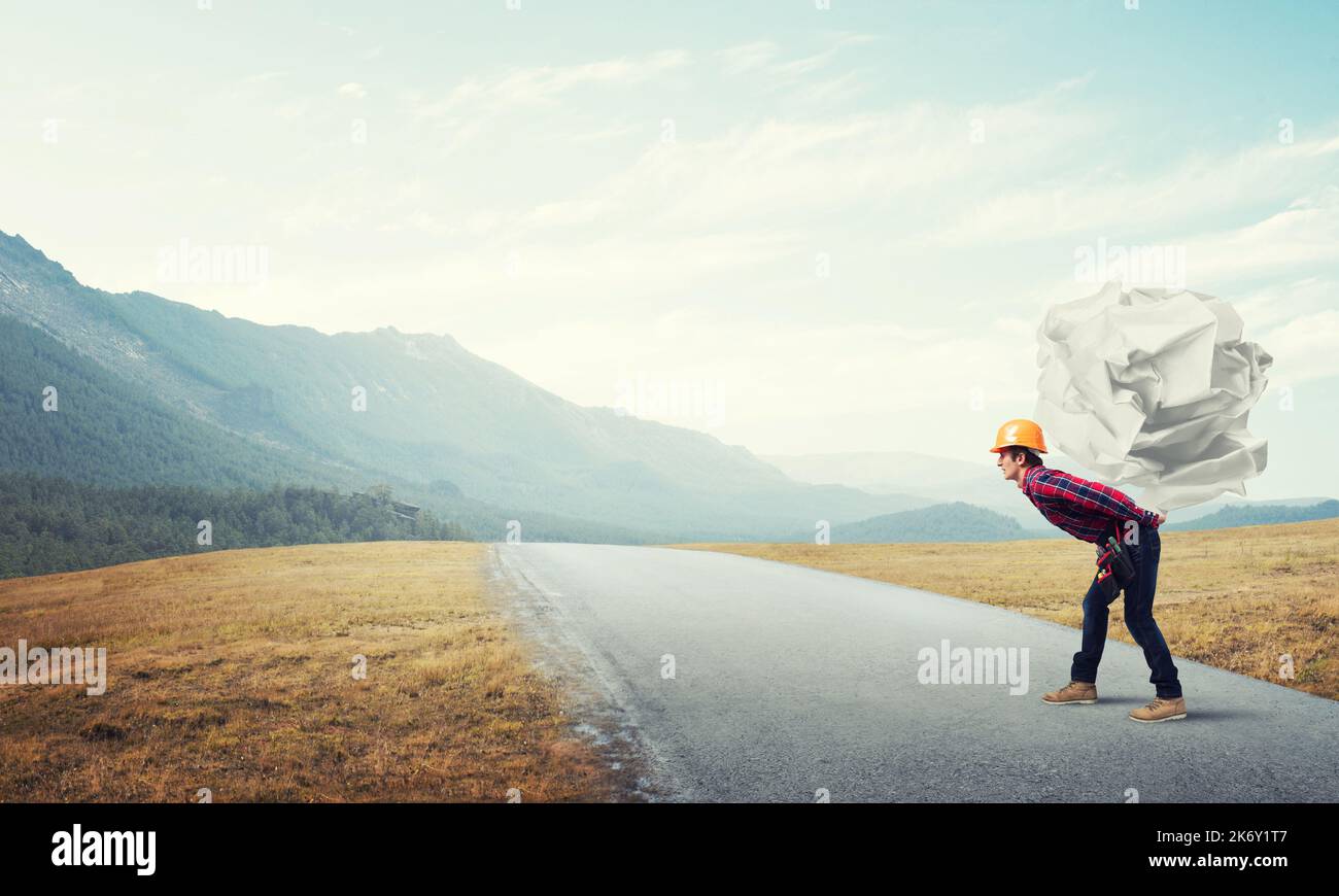 Engineer man carry load Stock Photo - Alamy