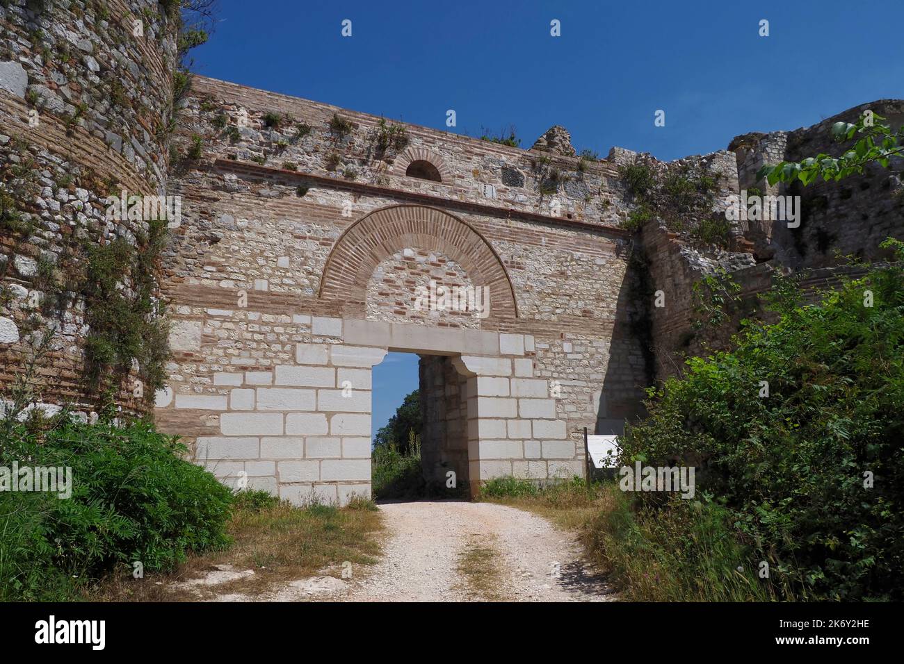 restored gate in the ancient walls of the archaeological site of ...