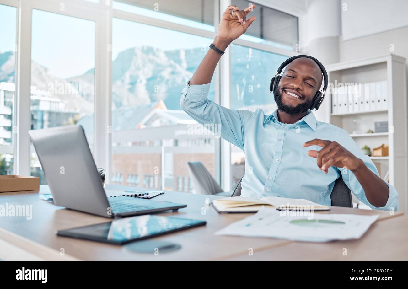 Feeling the rhythm move through me. a young businessman enjoying some ...