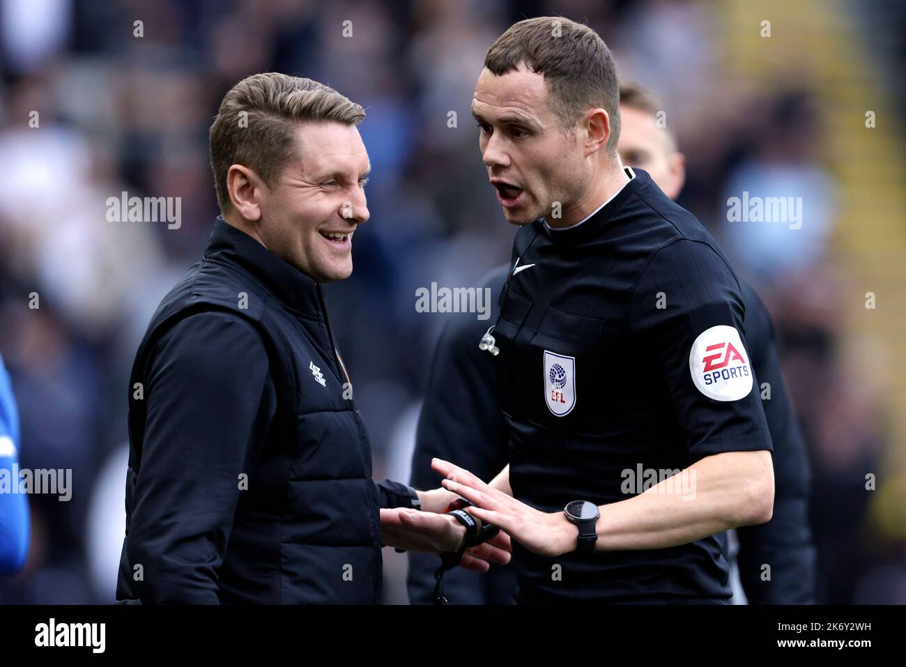 Referee David Dickinson (right) speaks to Hull City interim manager ...
