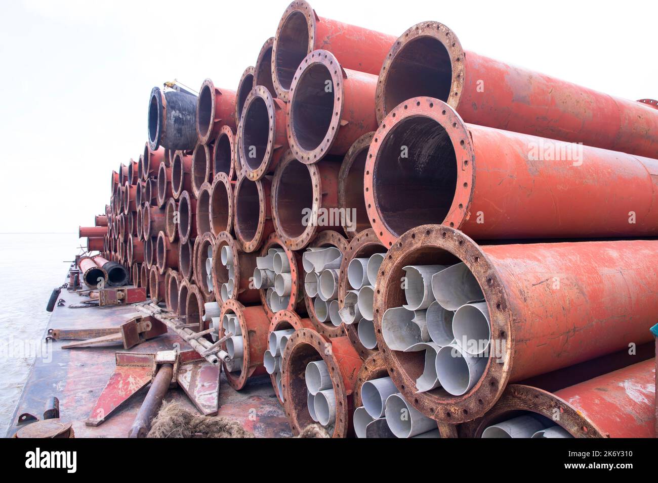 Rusted iron steel metal pipes stack an industrial field Stock Photo - Alamy