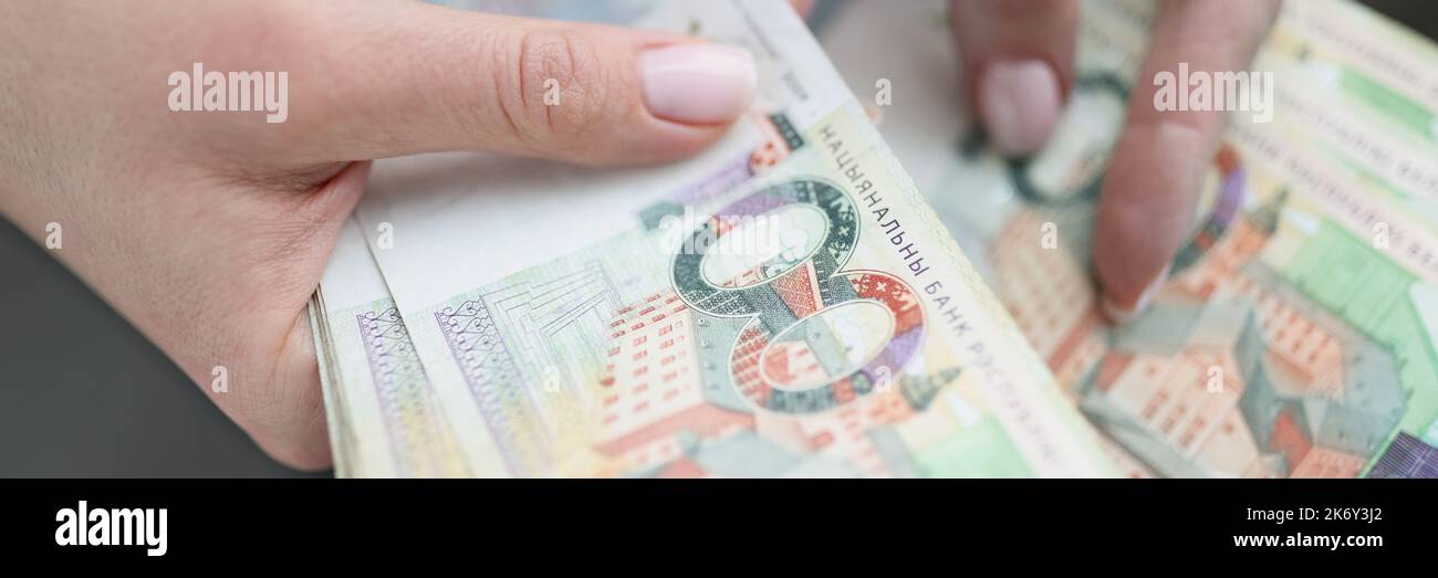 Women hand counting cash hi-res stock photography and images - Alamy