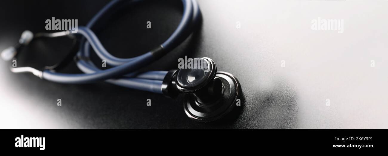 Black stethoscope on a dark matte background Stock Photo - Alamy