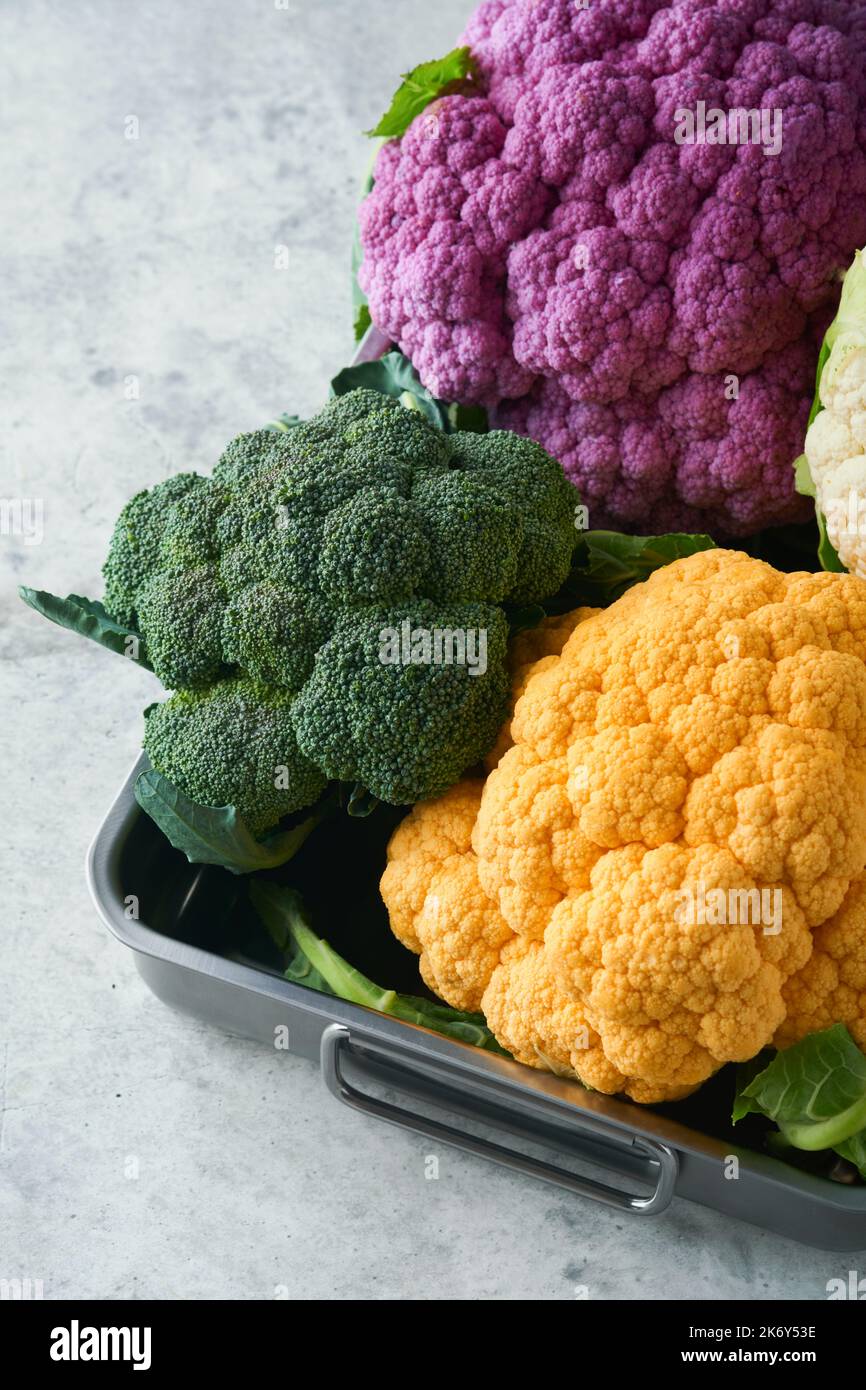 Colorfu cauliflower. Various sort of cauliflower on gray concrete ...
