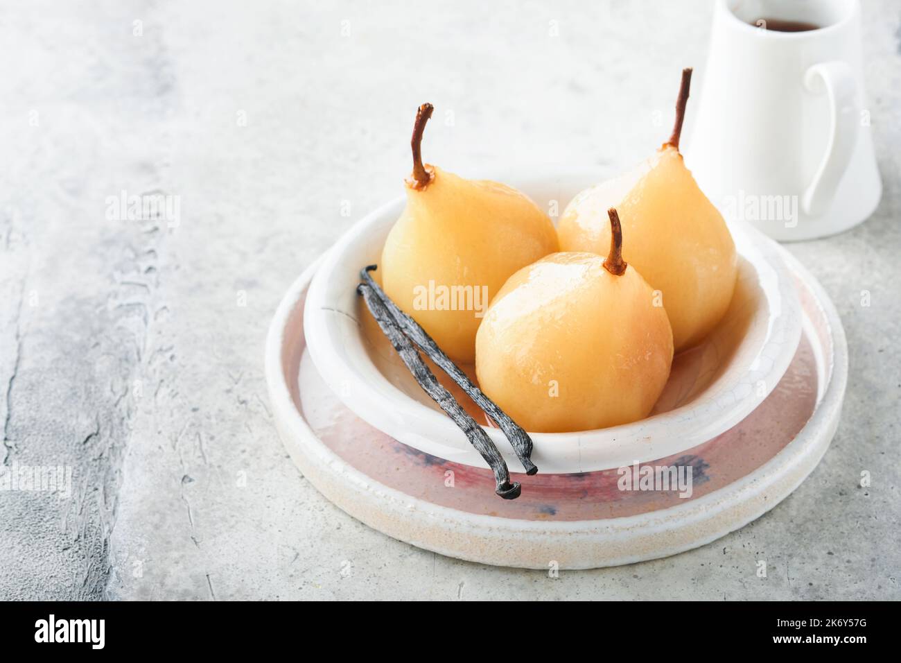 Pears. Poached pears in syrup. Traditional dessert sliced server in a ...