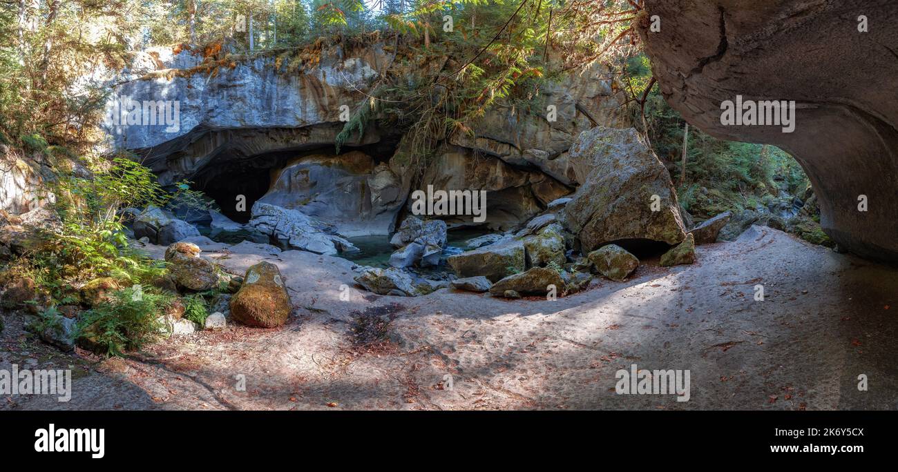 Cave and river in a canyon. Canadian Nature Background. Panorama ...
