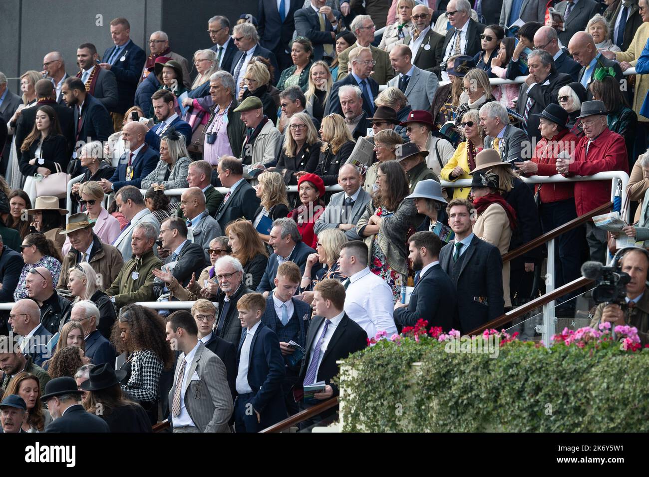 Ascot, Berkshire, UK. 15th October, 2022. Racegoers watch the horses in ...