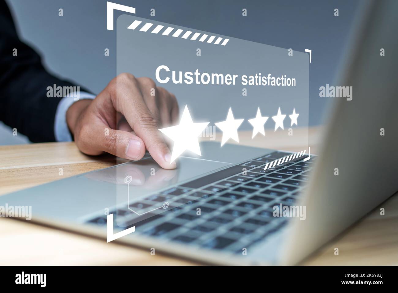 businessman hand touching on digital laptop computer with five star ...
