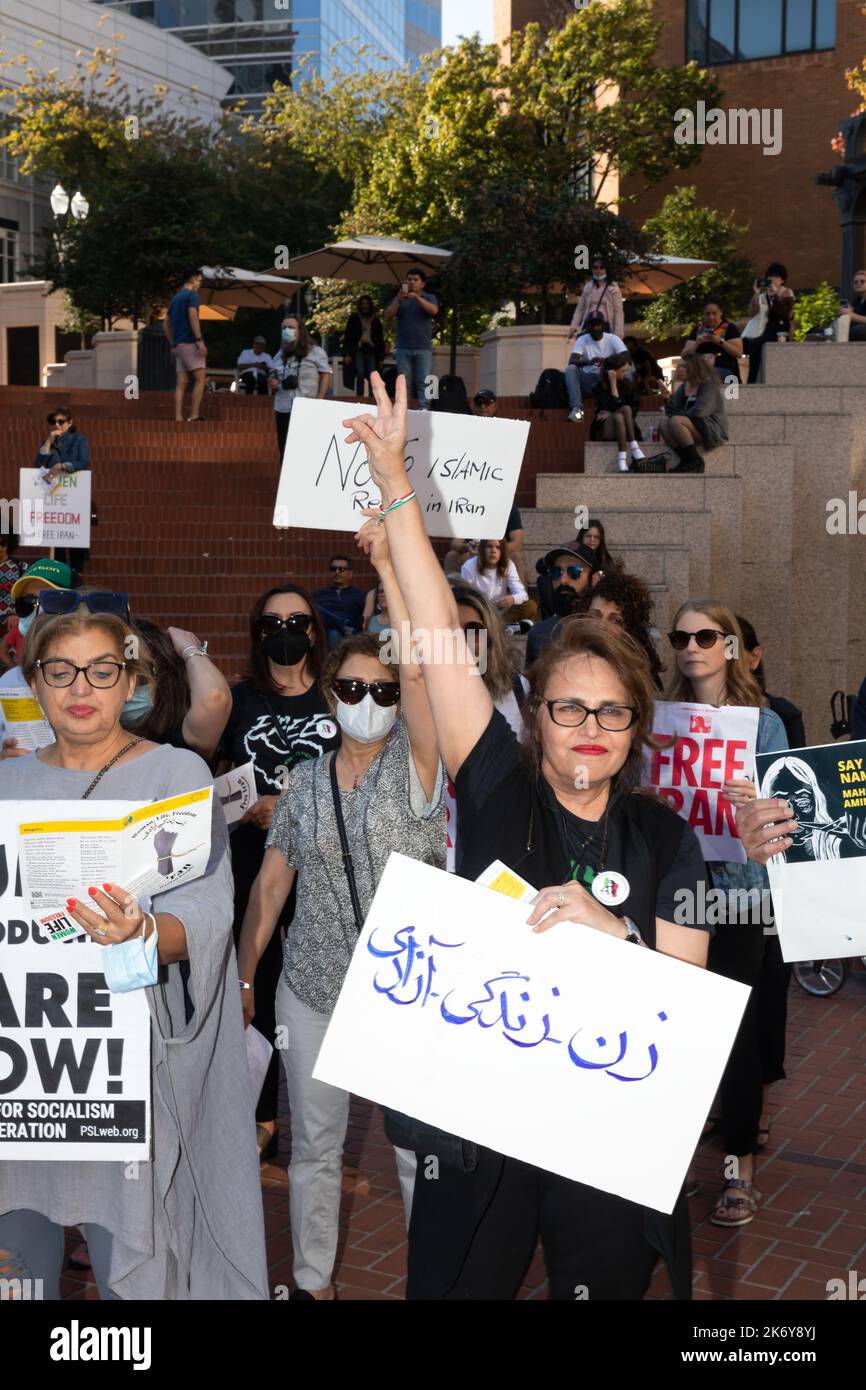 Portland, United States. 15th Oct, 2022. Protesters hold placards ...