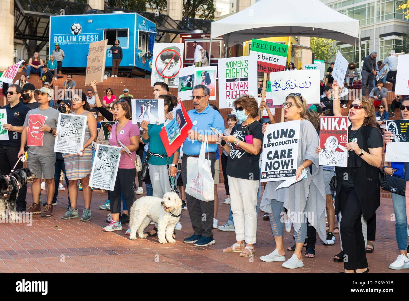 Portland, United States. 15th Oct, 2022. Protesters hold placards ...
