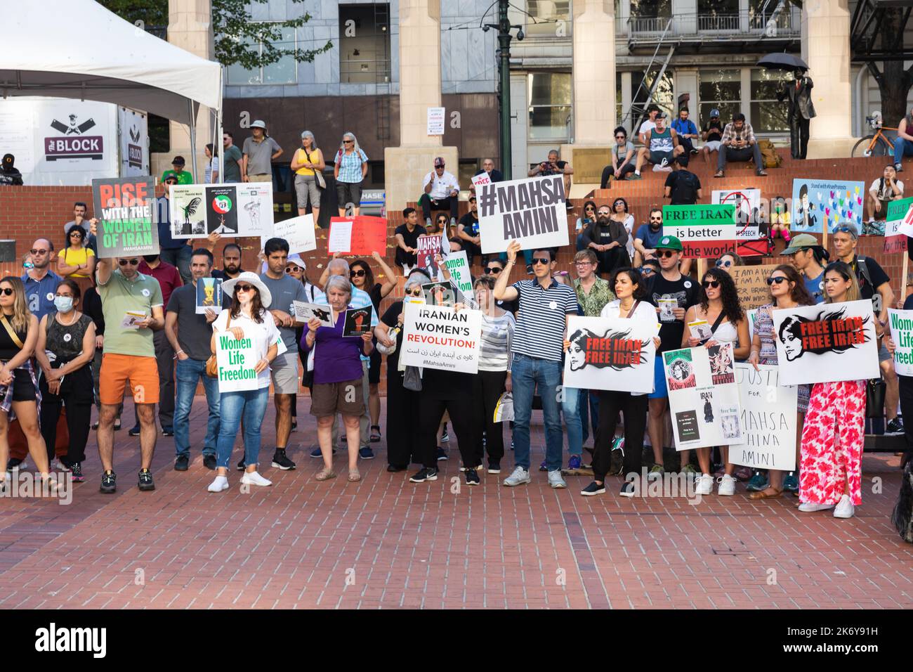 Portland, United States. 15th Oct, 2022. Protesters hold placards ...