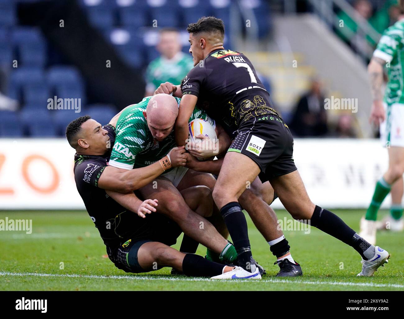 Ireland's George King is tackled by Jamaica's Kieran Rush (right) and ...